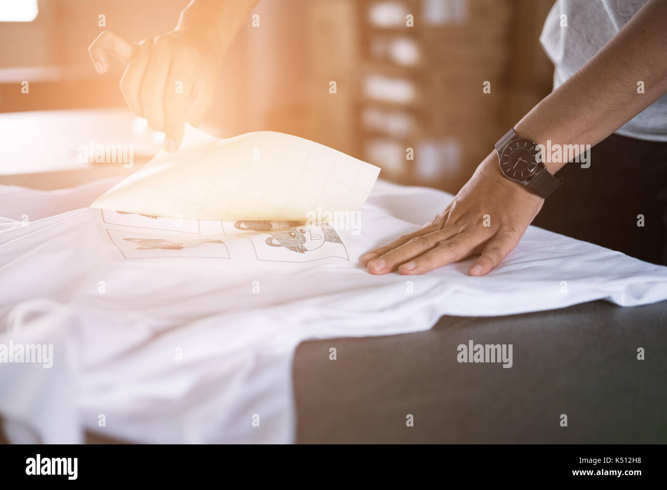 Young woman pull out paper from waterproof film on fabric. worker ...