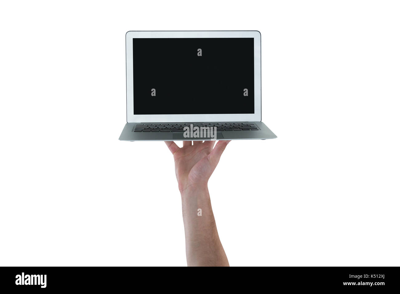 Hand holding laptop against white background Stock Photo - Alamy