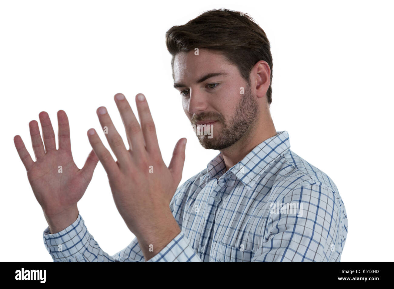 Handsome man gesturing against white background Stock Photo - Alamy