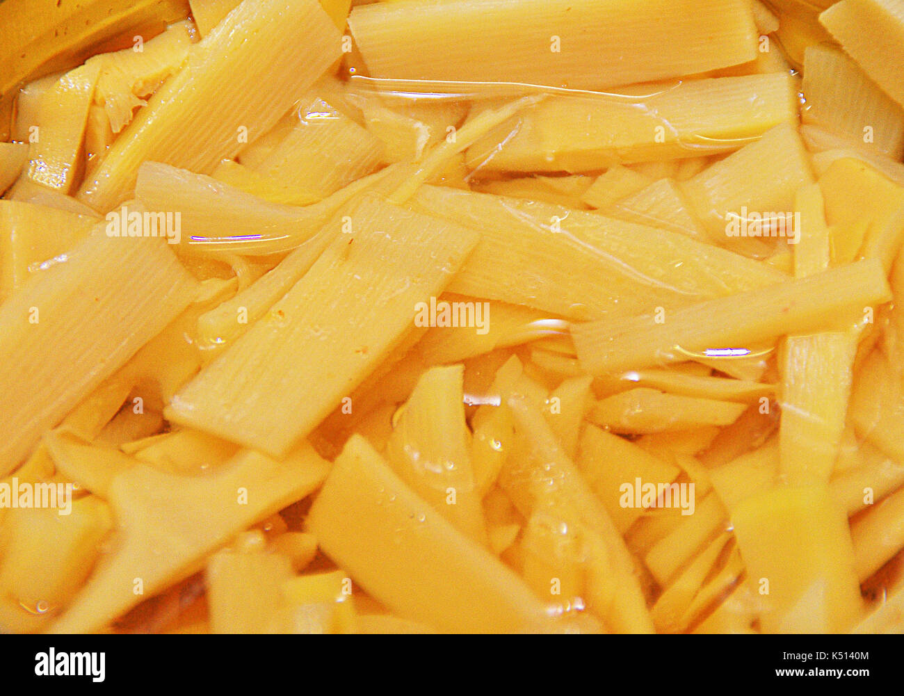 Bamboo shots ready to be cooked on sauce Stock Photo - Alamy