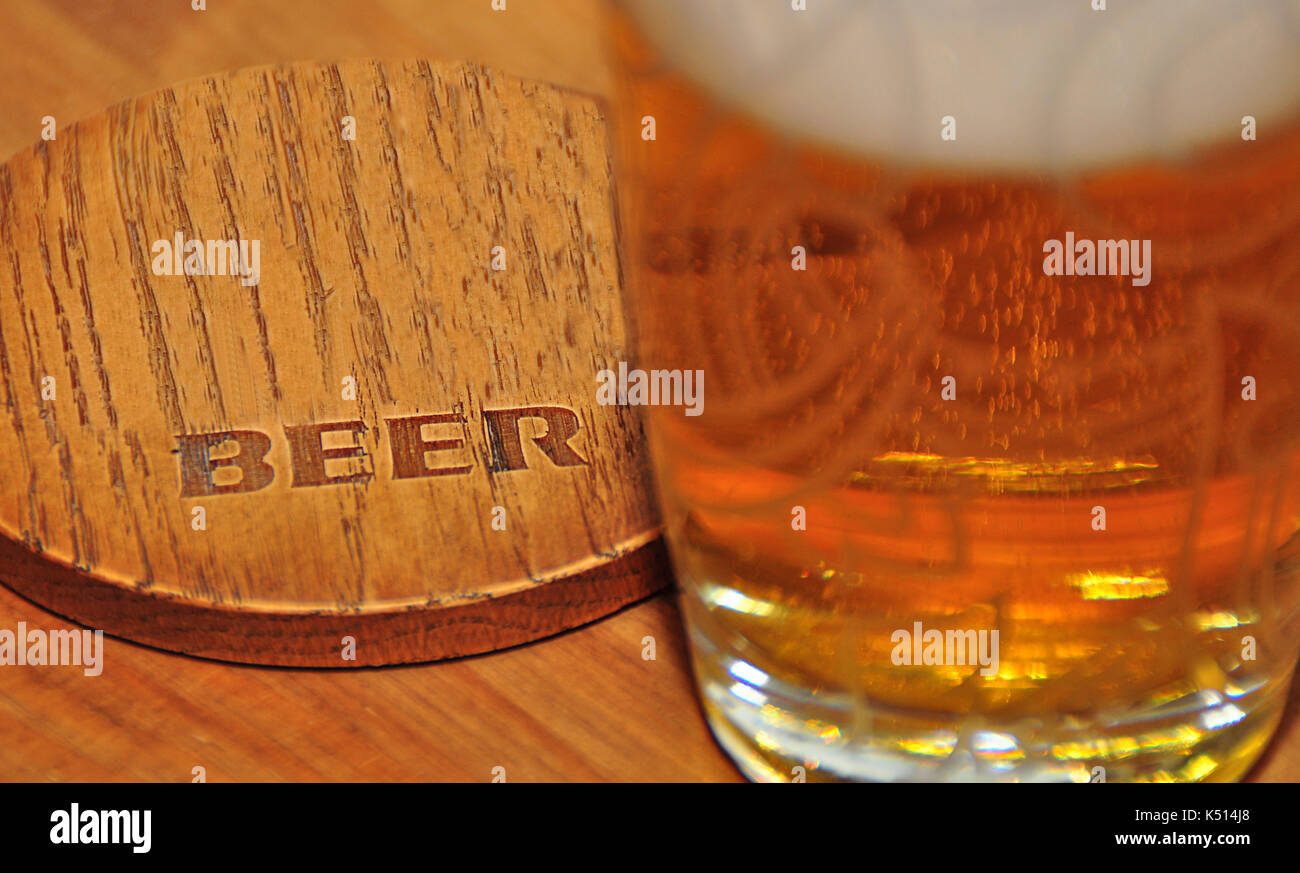Coaster and cold beer in close up Stock Photo - Alamy