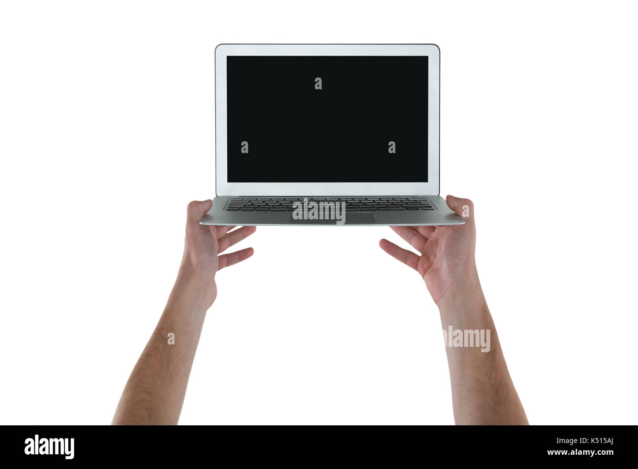 Hand holding laptop against white background Stock Photo - Alamy