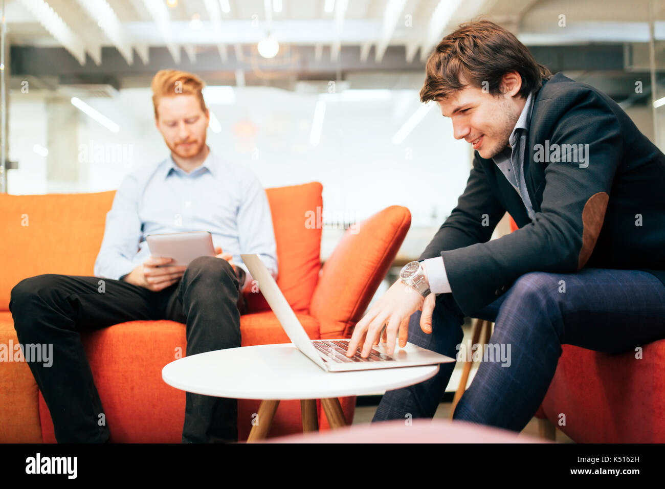 Business colleagues talking during break Stock Photo - Alamy