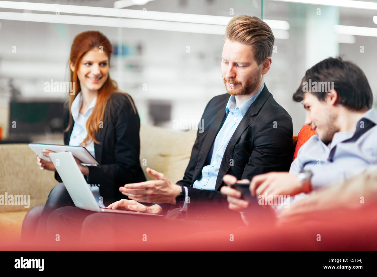Business people conversation. Technology at hand Stock Photo - Alamy