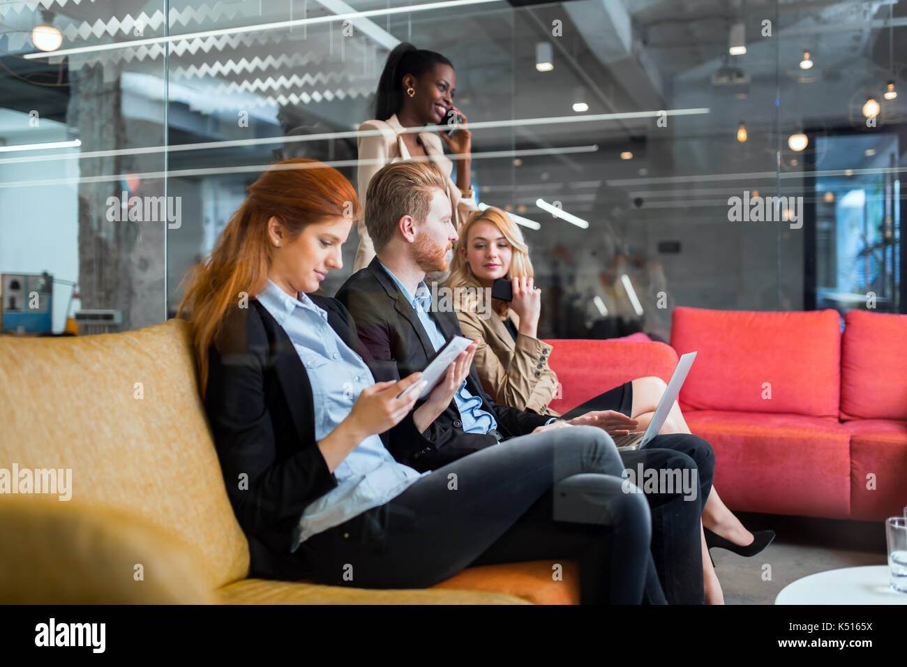 Business people conversation. Technology at hand Stock Photo - Alamy