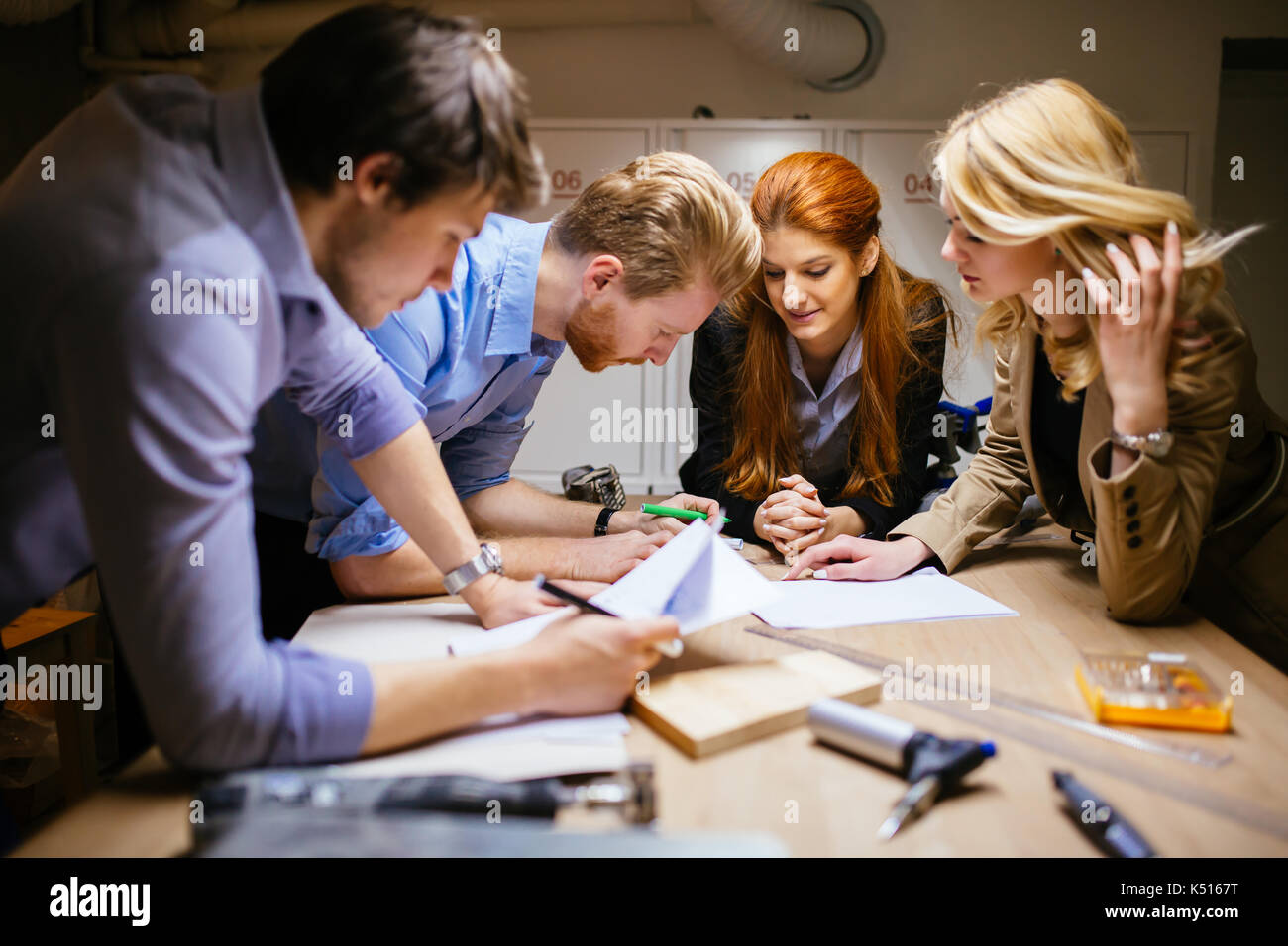 Team working on project together Stock Photo - Alamy