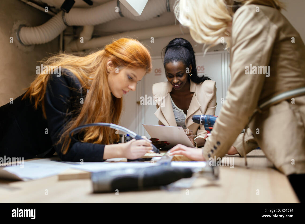Team working on project together Stock Photo - Alamy