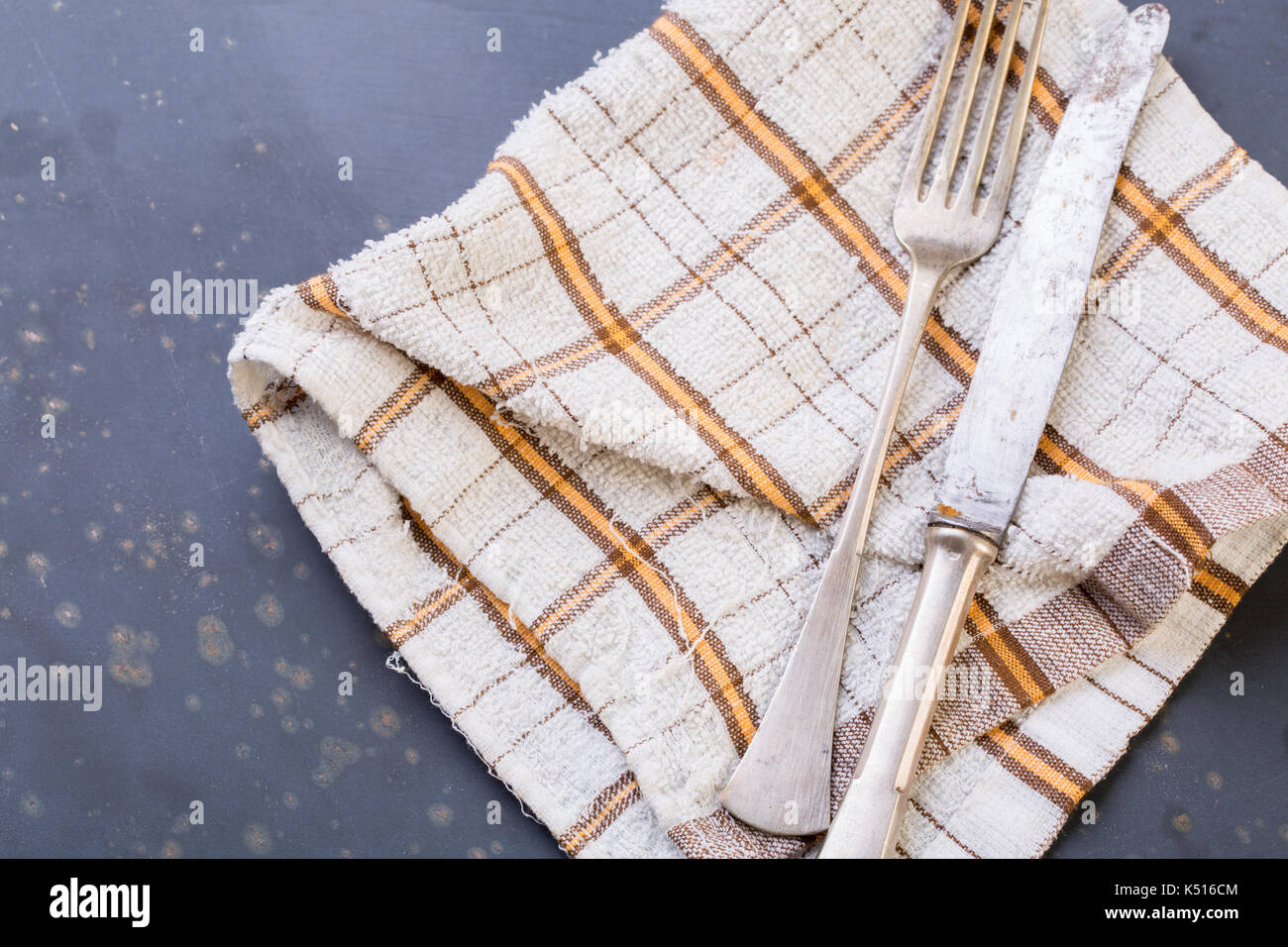 Empty setup with stone, fork and knife Stock Photo - Alamy
