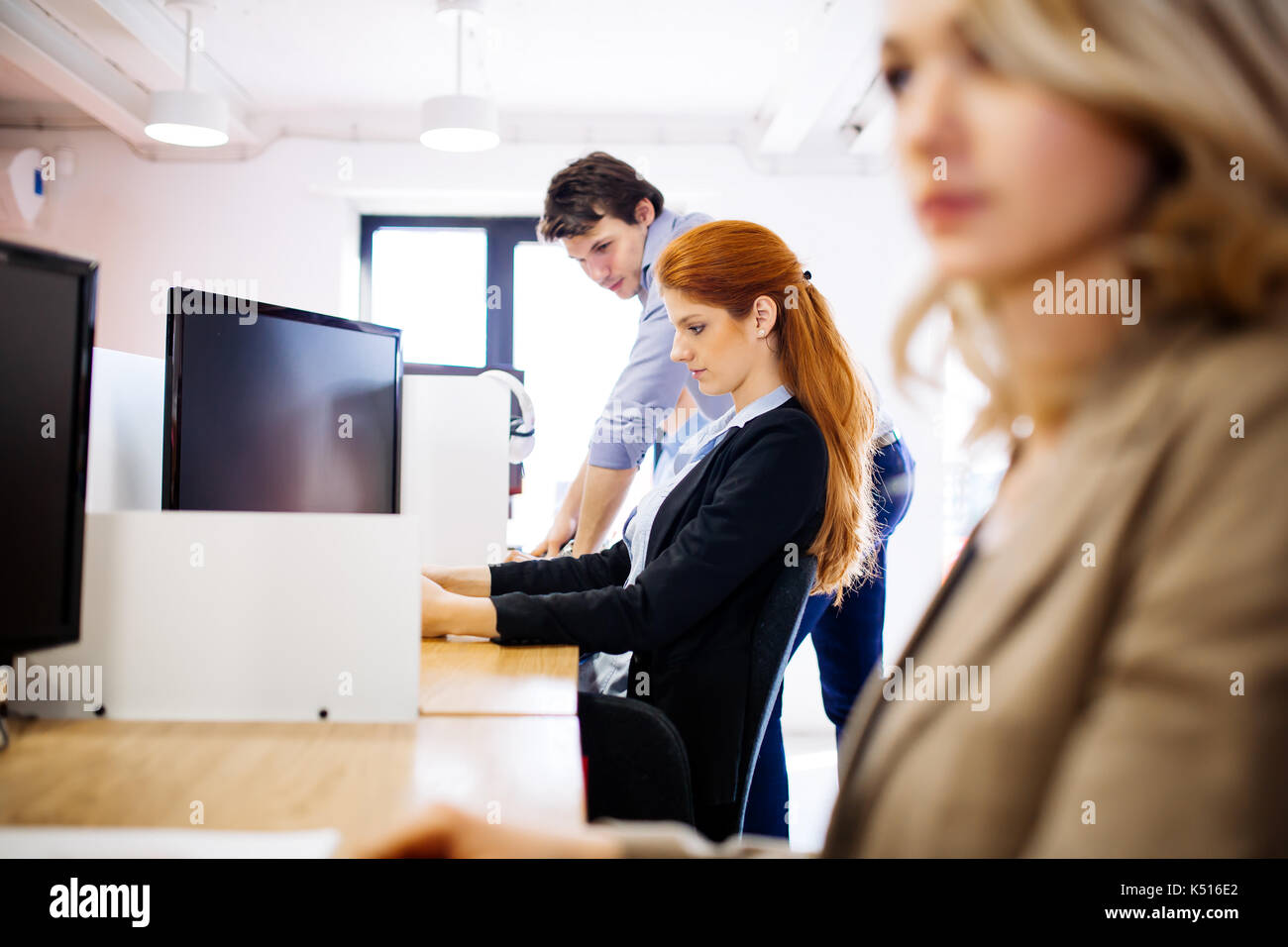 Person looking over computer screen hi-res stock photography and images ...