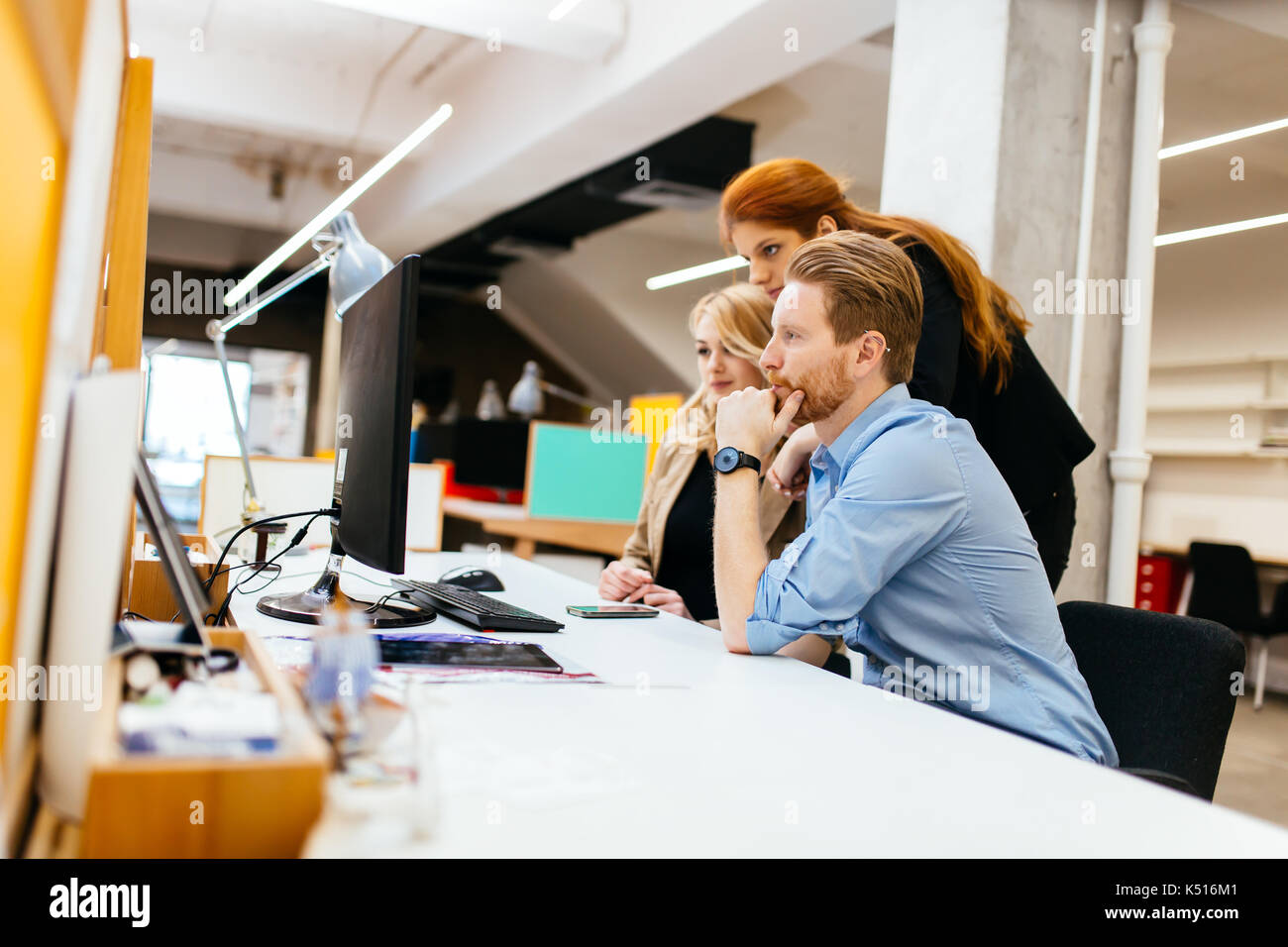 Coworkers solving problems together Stock Photo - Alamy