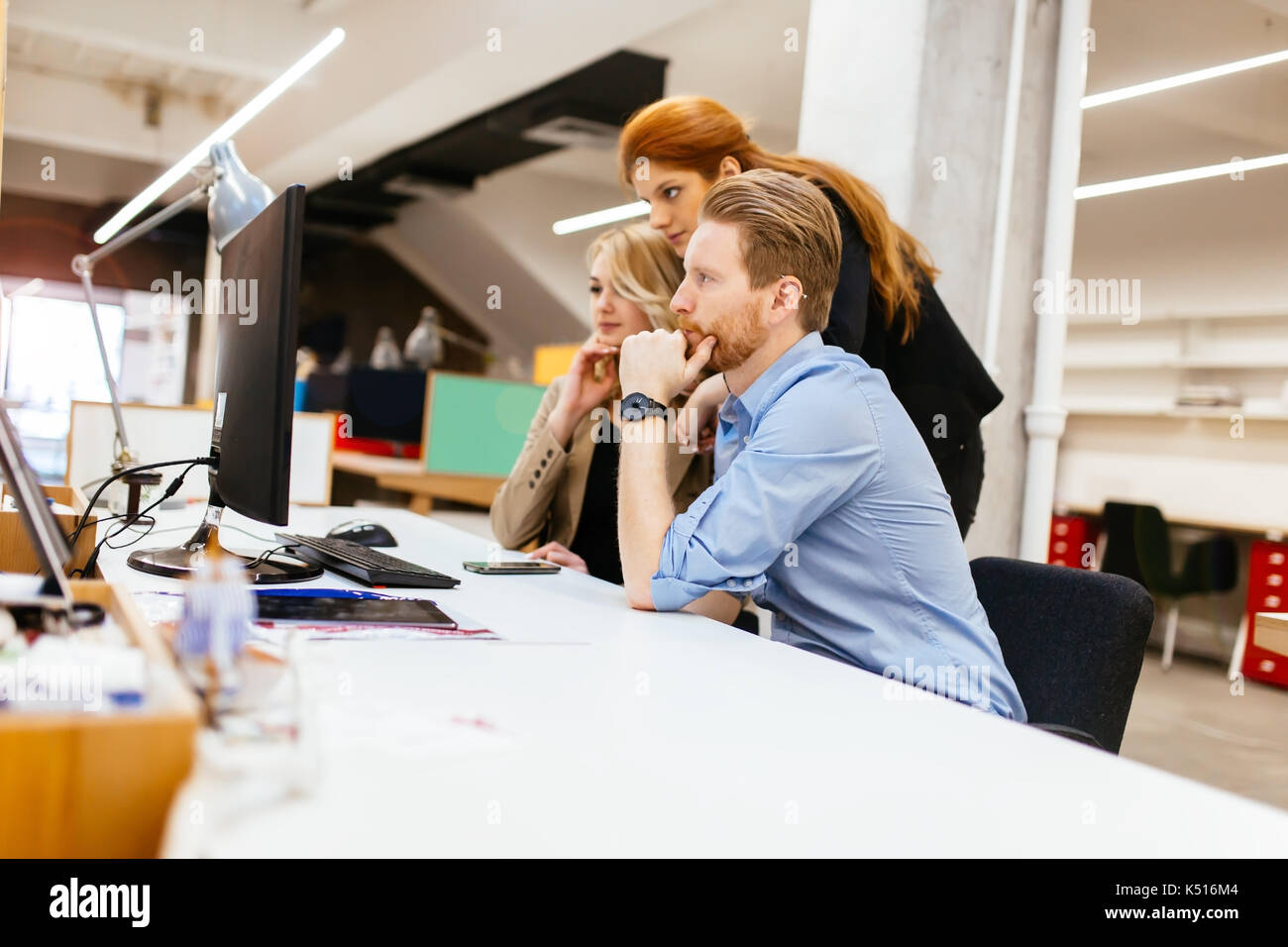 Business people collaborating in office Stock Photo - Alamy