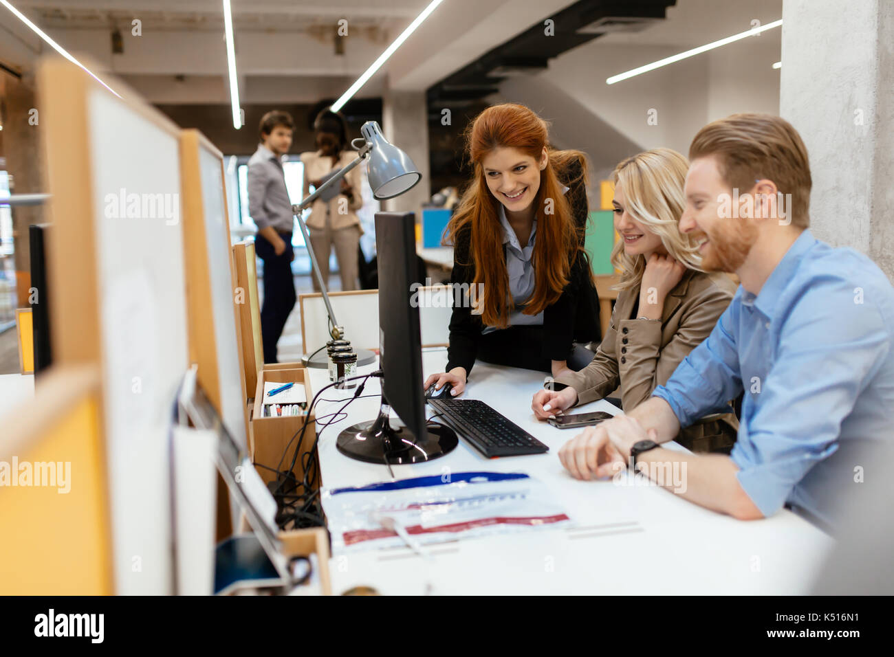 Coworkers solving problems together Stock Photo - Alamy