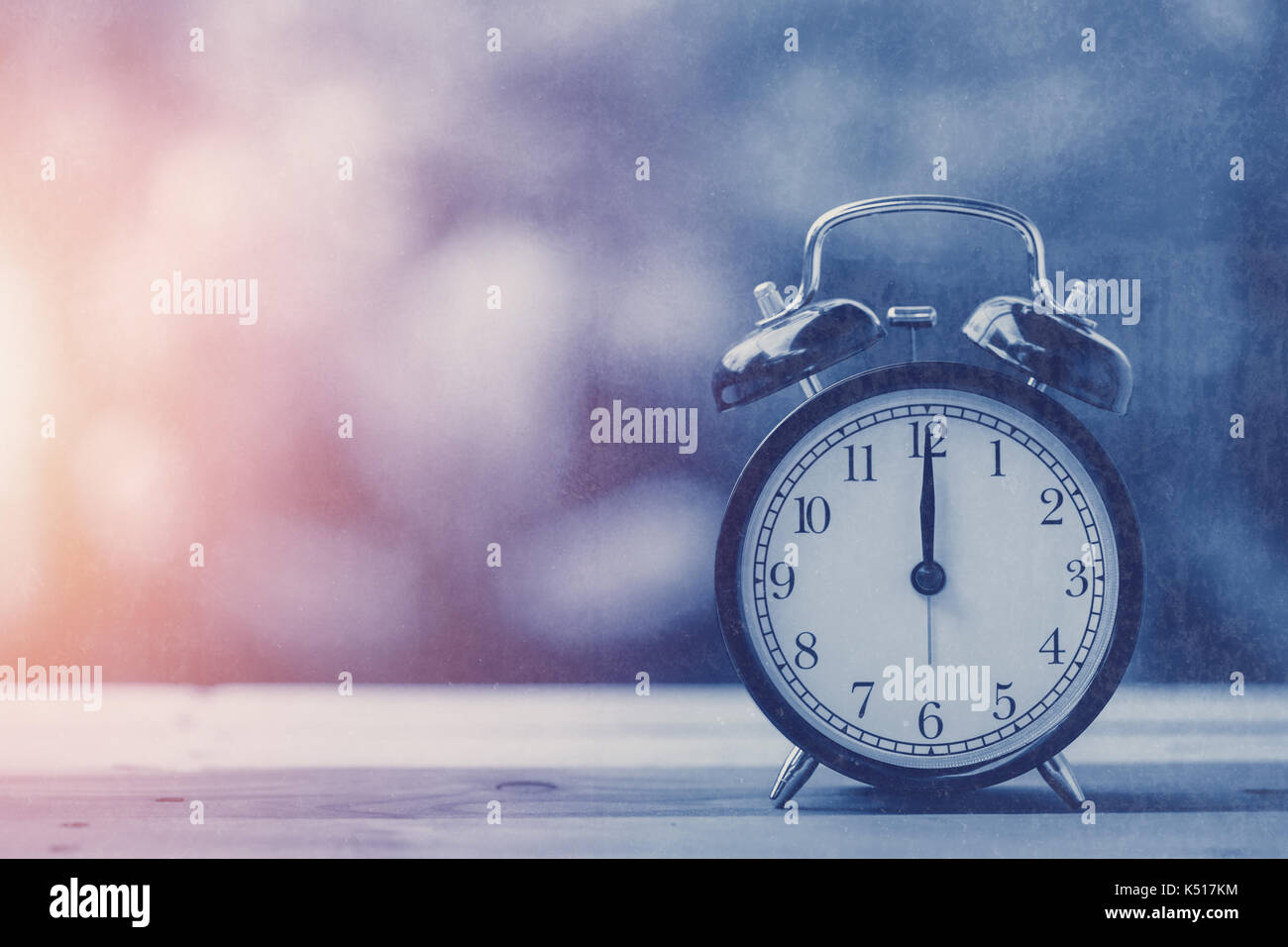 12 o'clock retro clock vintage blue color tone with sun light Stock ...