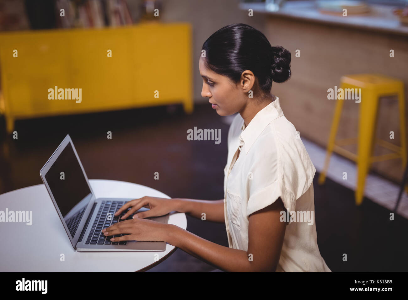 Smart woman sitting on stool hi-res stock photography and images - Alamy