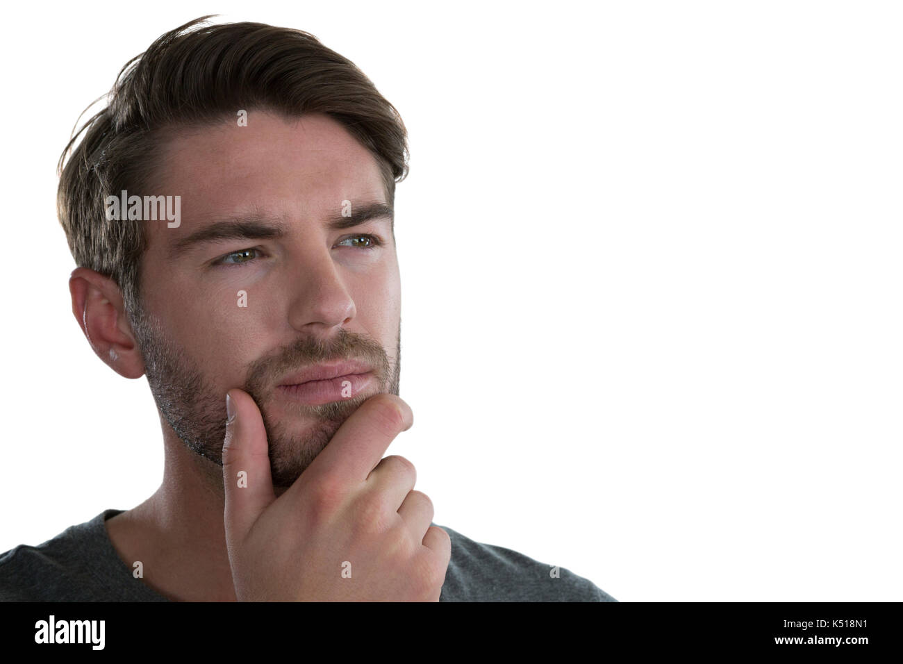 Close-up of thoughtful man against white background Stock Photo - Alamy