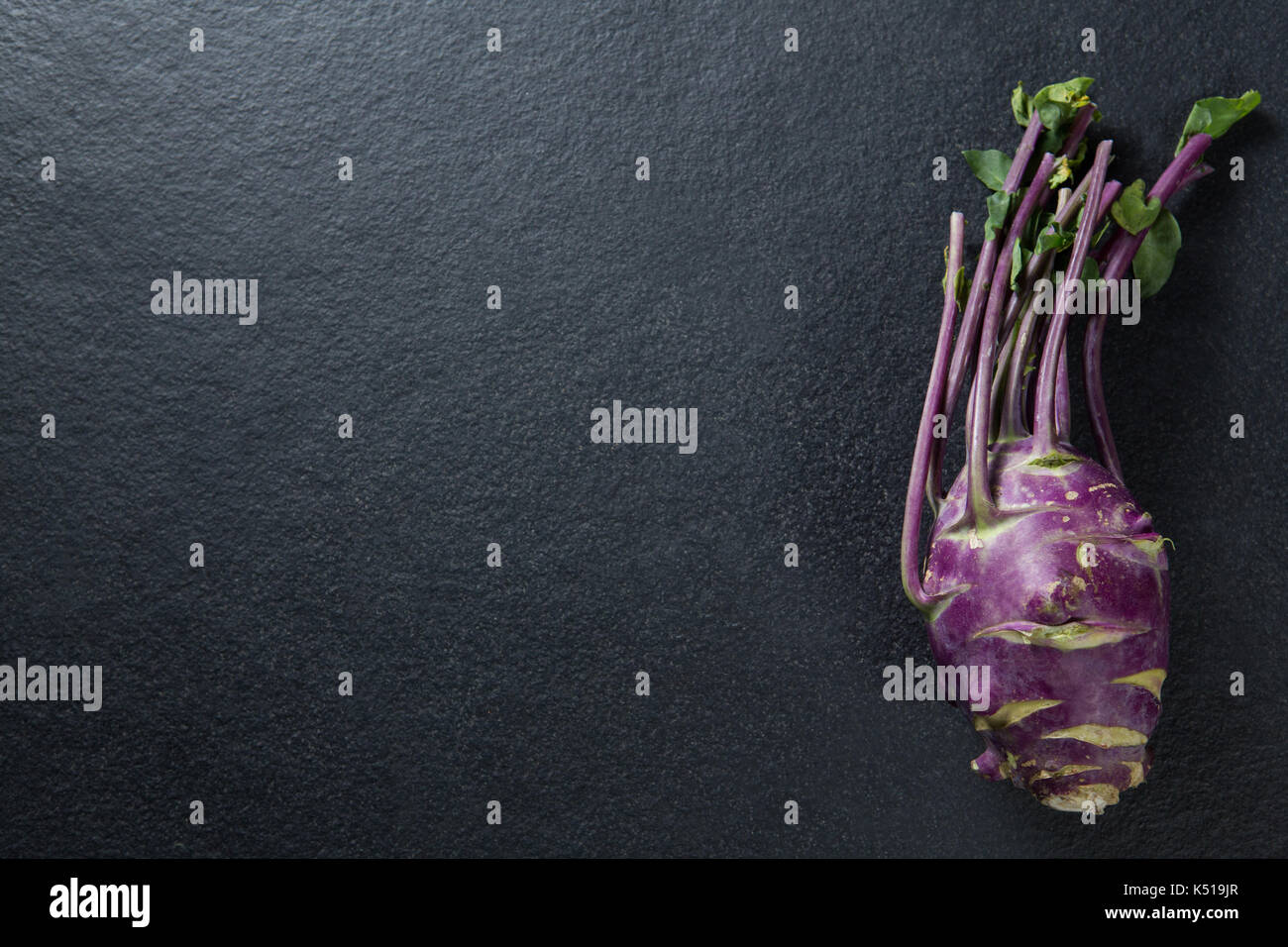 Overhead view of root vegetable on gray slate Stock Photo - Alamy