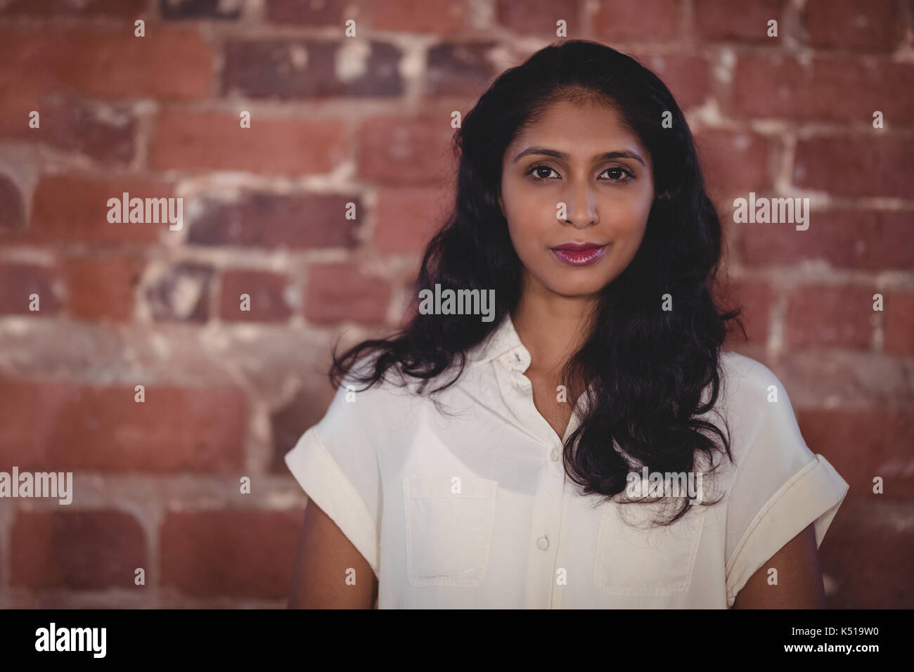 Indian business man standing against wall hi-res stock photography and ...