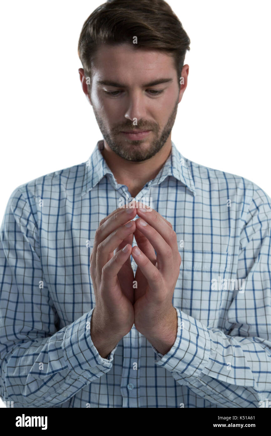 Man pretending to hold an invisible object against white background ...