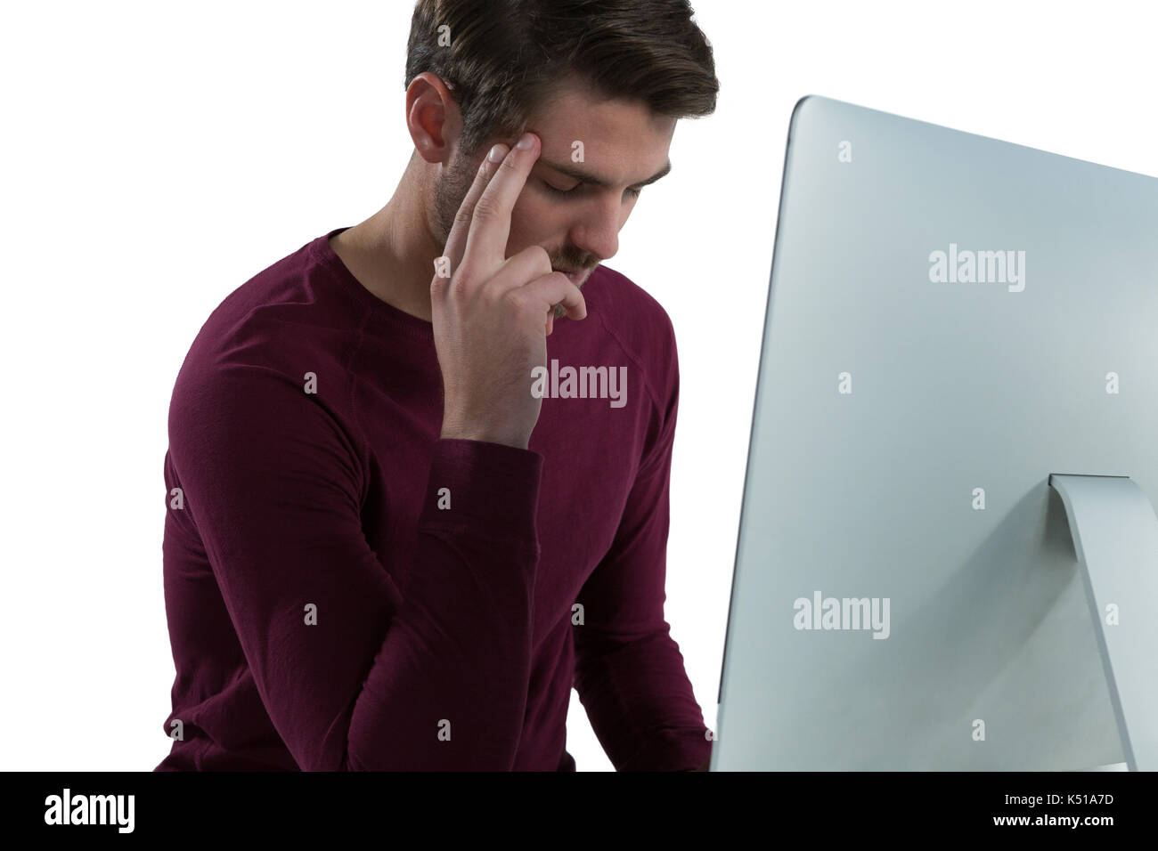 Man sleeping while using computer against white background Stock Photo ...
