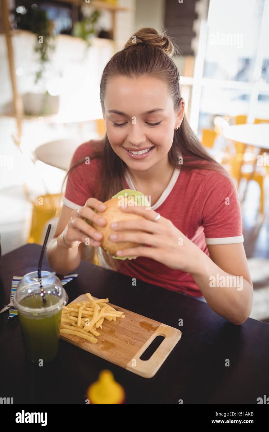 Smart eating burger hi-res stock photography and images - Alamy
