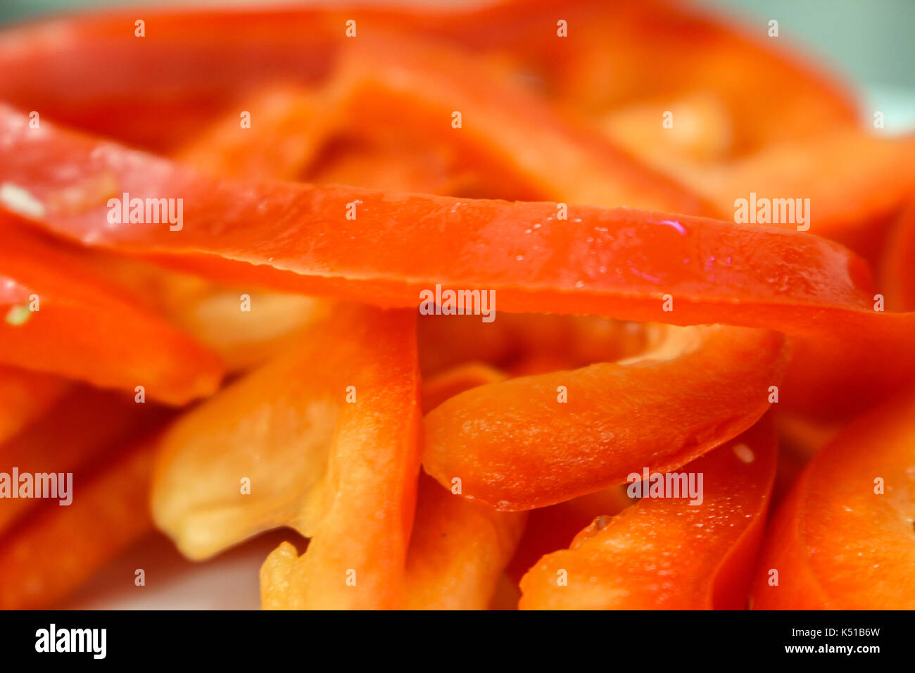 Red pepper sliced julienne closeup Stock Photo - Alamy