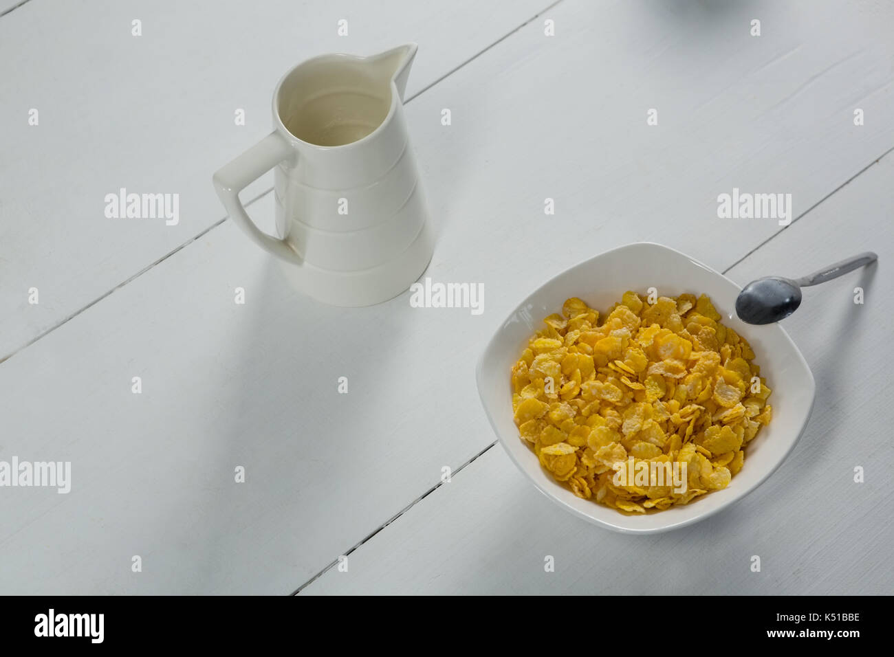 Bowl of wheaties cereal with spoon on white background Stock Photo - Alamy