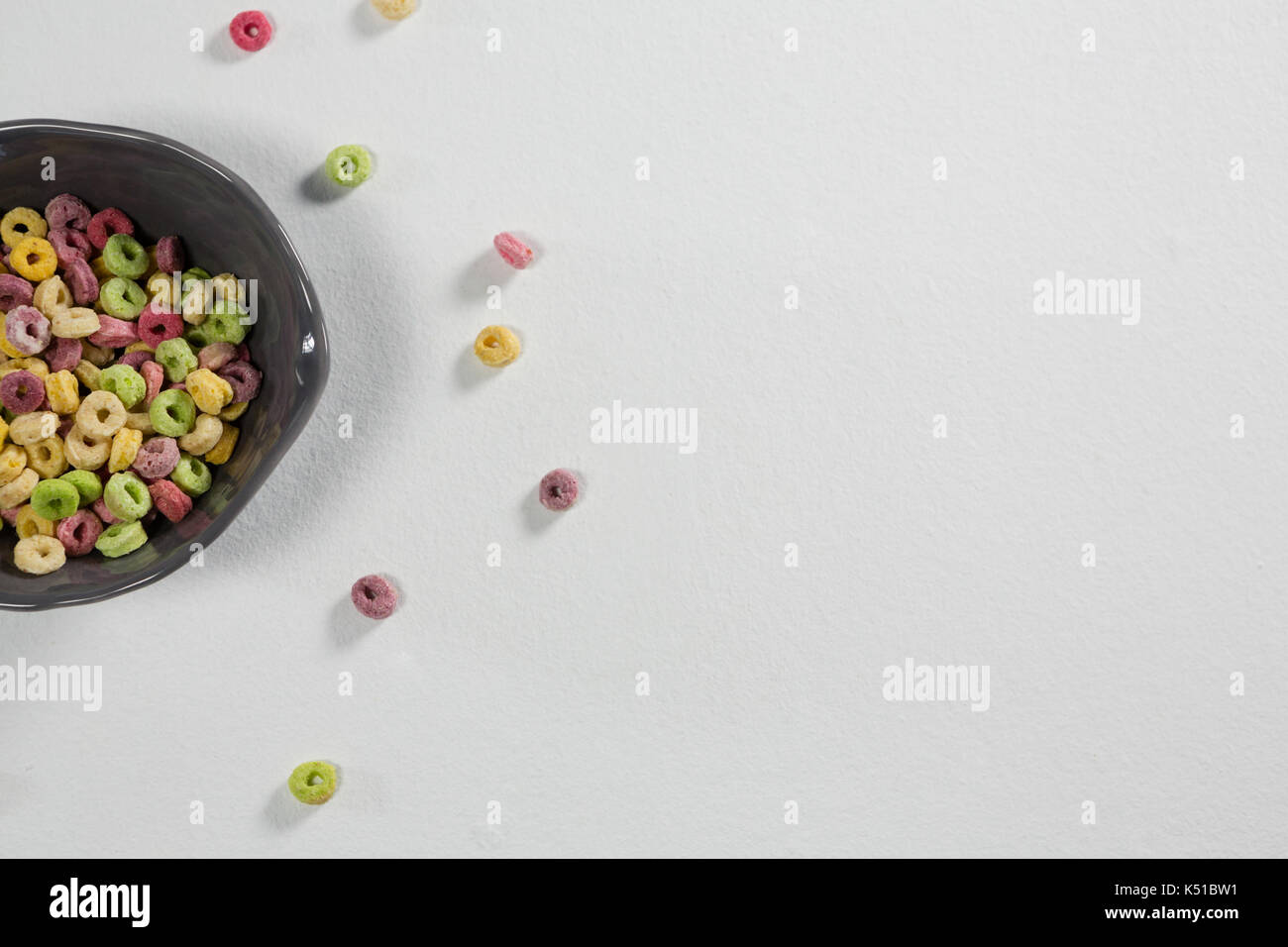 Bowl of froot loops on white background Stock Photo - Alamy