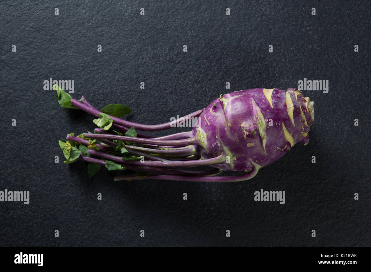 Overhead view of root vegetable on slate Stock Photo - Alamy