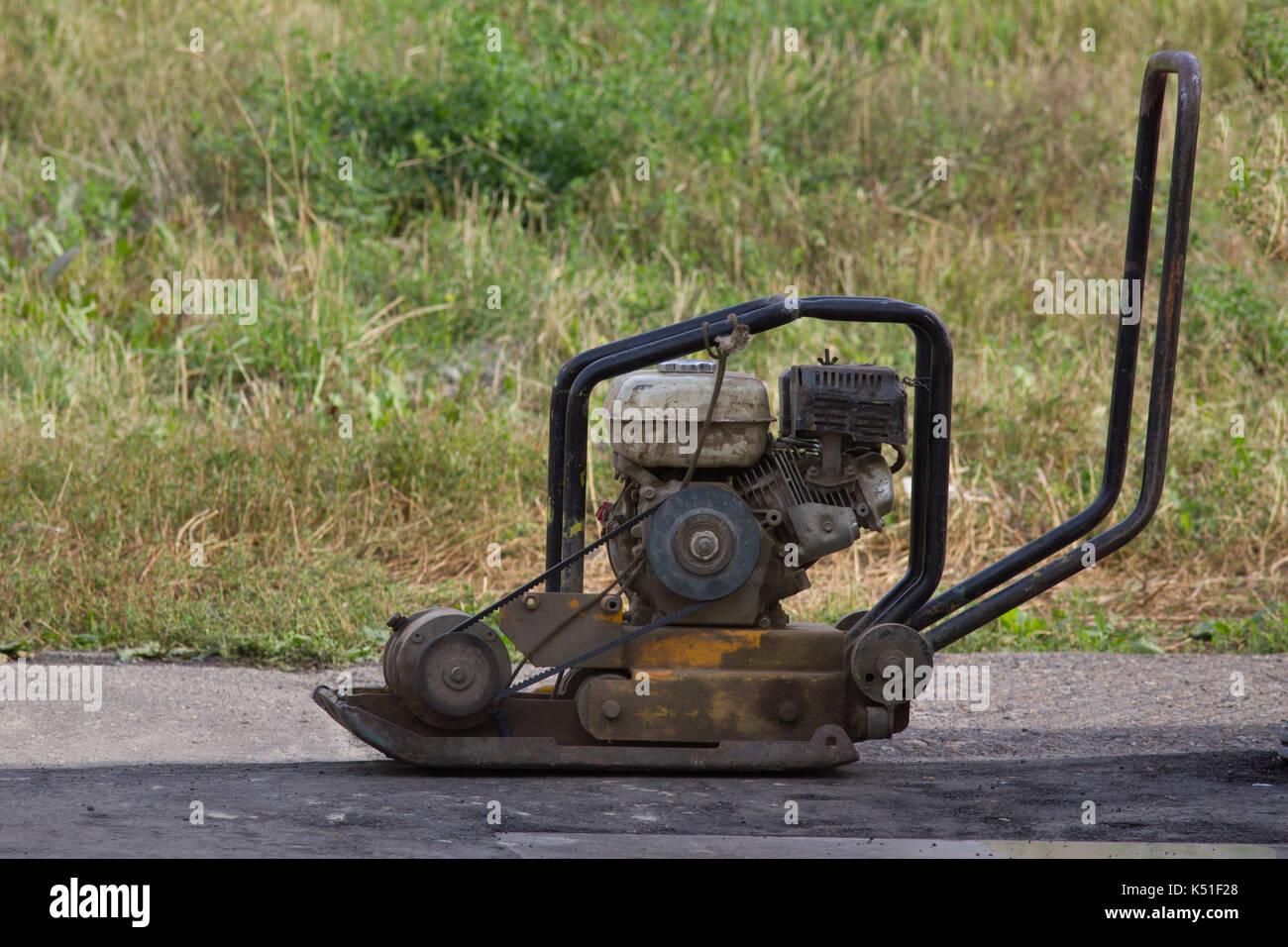 Manual ramming machine for road construction - telephoto Stock Photo ...