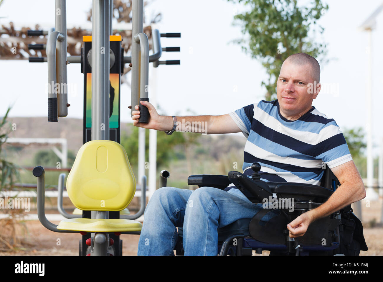 Disabled male in wheelchair working out Stock Photo - Alamy