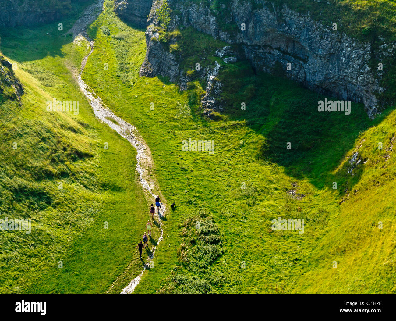 View looking down on walkers in Cave Dale a dry limestone valley near ...