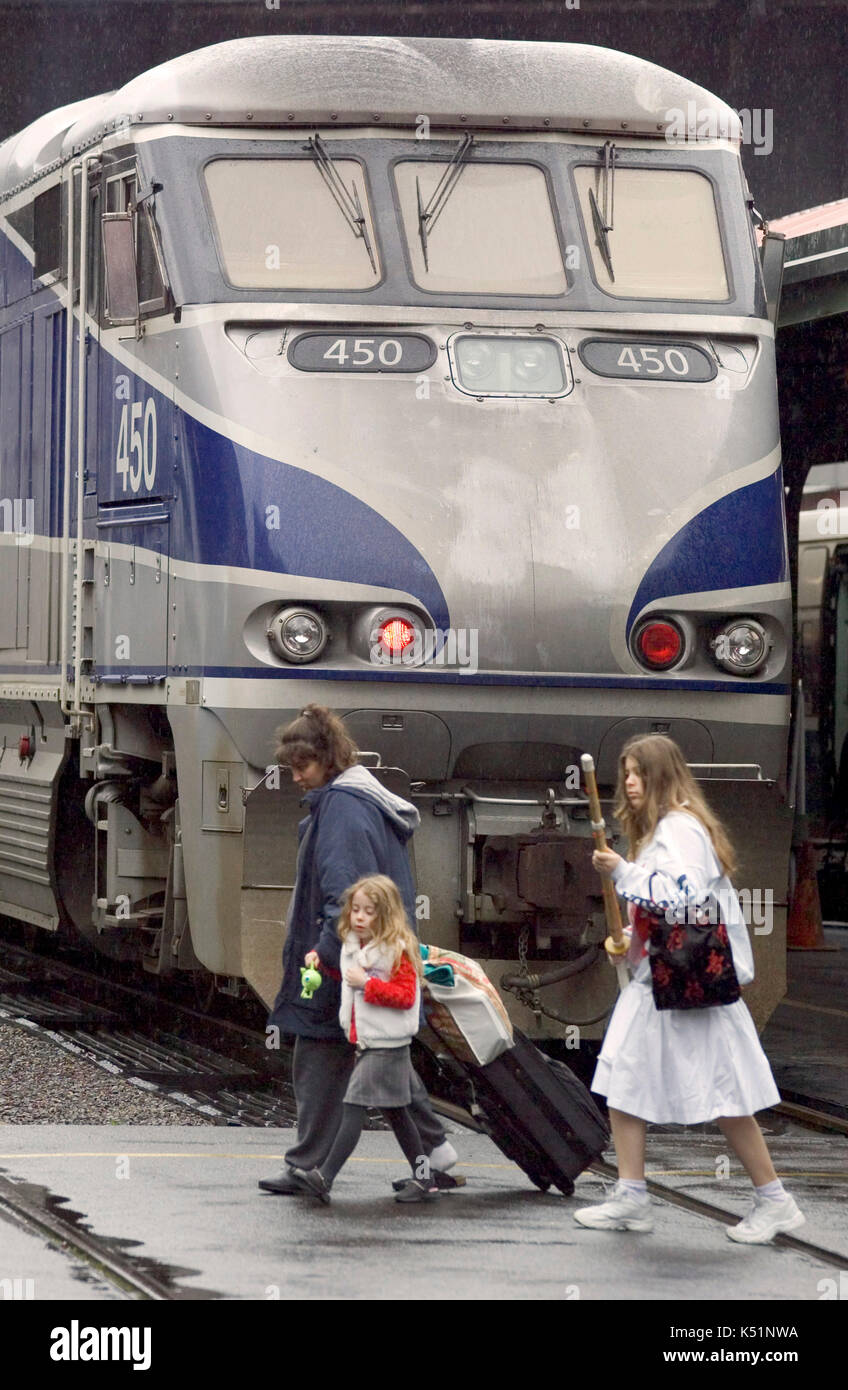Arriving Passengers With Carry On Luggage Cross The Tracks At The Portland Or Railroad Station
