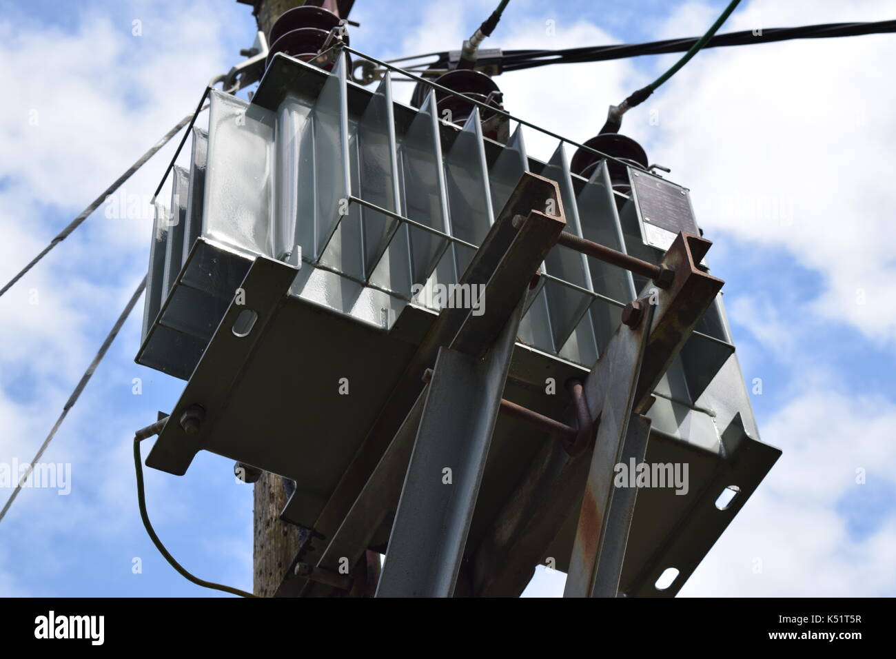 Large transformer on a pole Stock Photo - Alamy