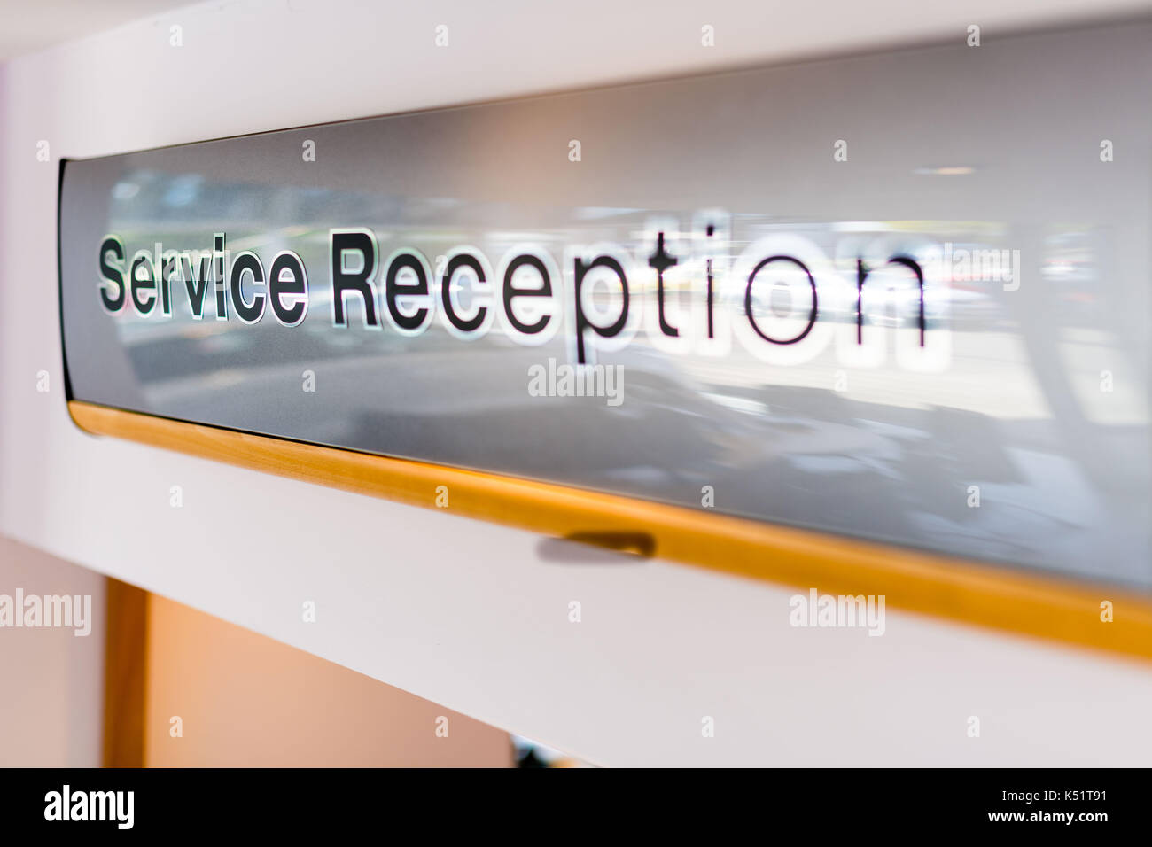 Service reception sign in a car showroom Stock Photo - Alamy