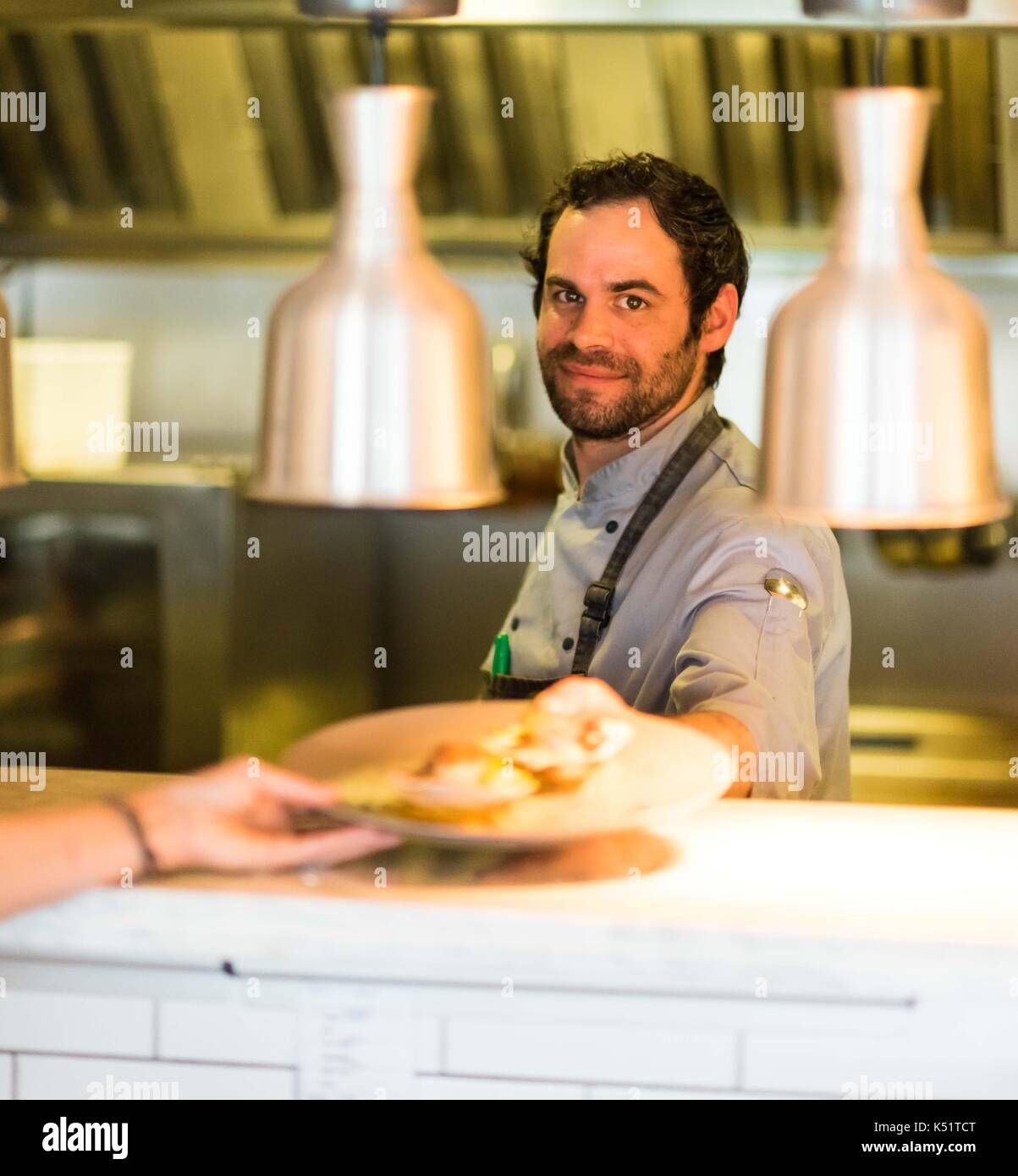 Chef serving food hi-res stock photography and images - Alamy