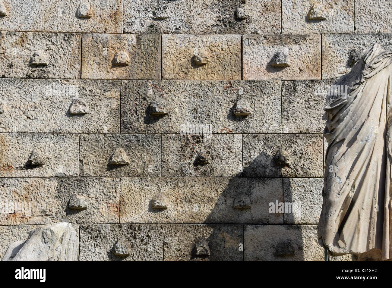 Weathered marble statue and textured wall at the Ancient Agora of ...