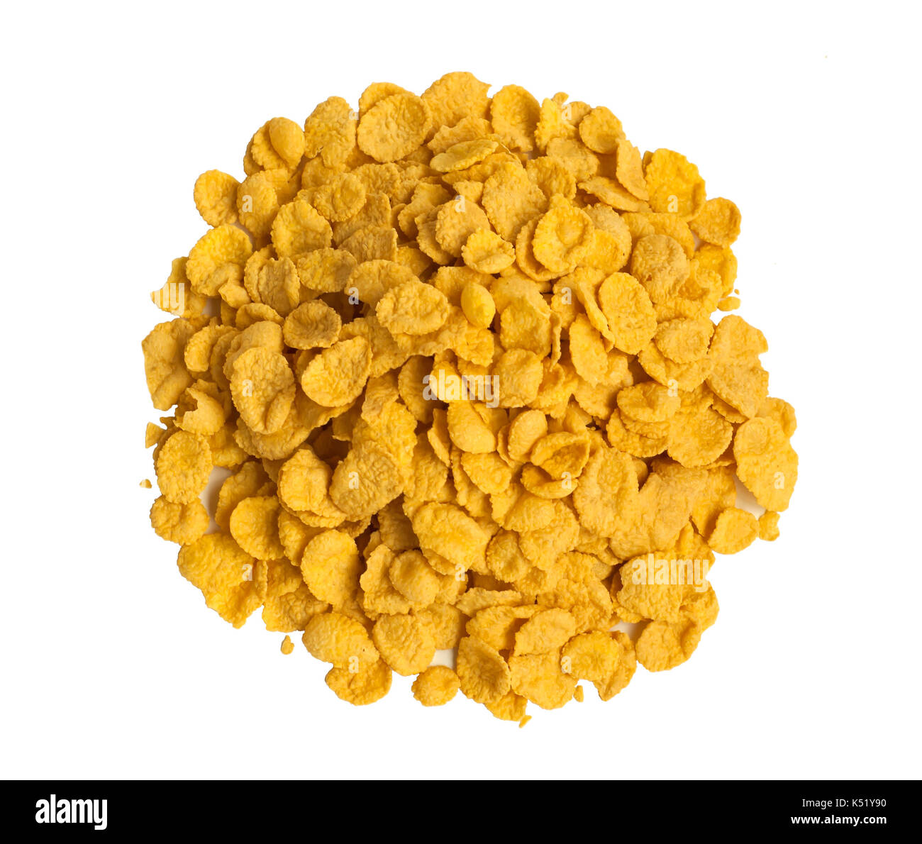 Handful of golden dried cornflakes on a white background Stock Photo ...