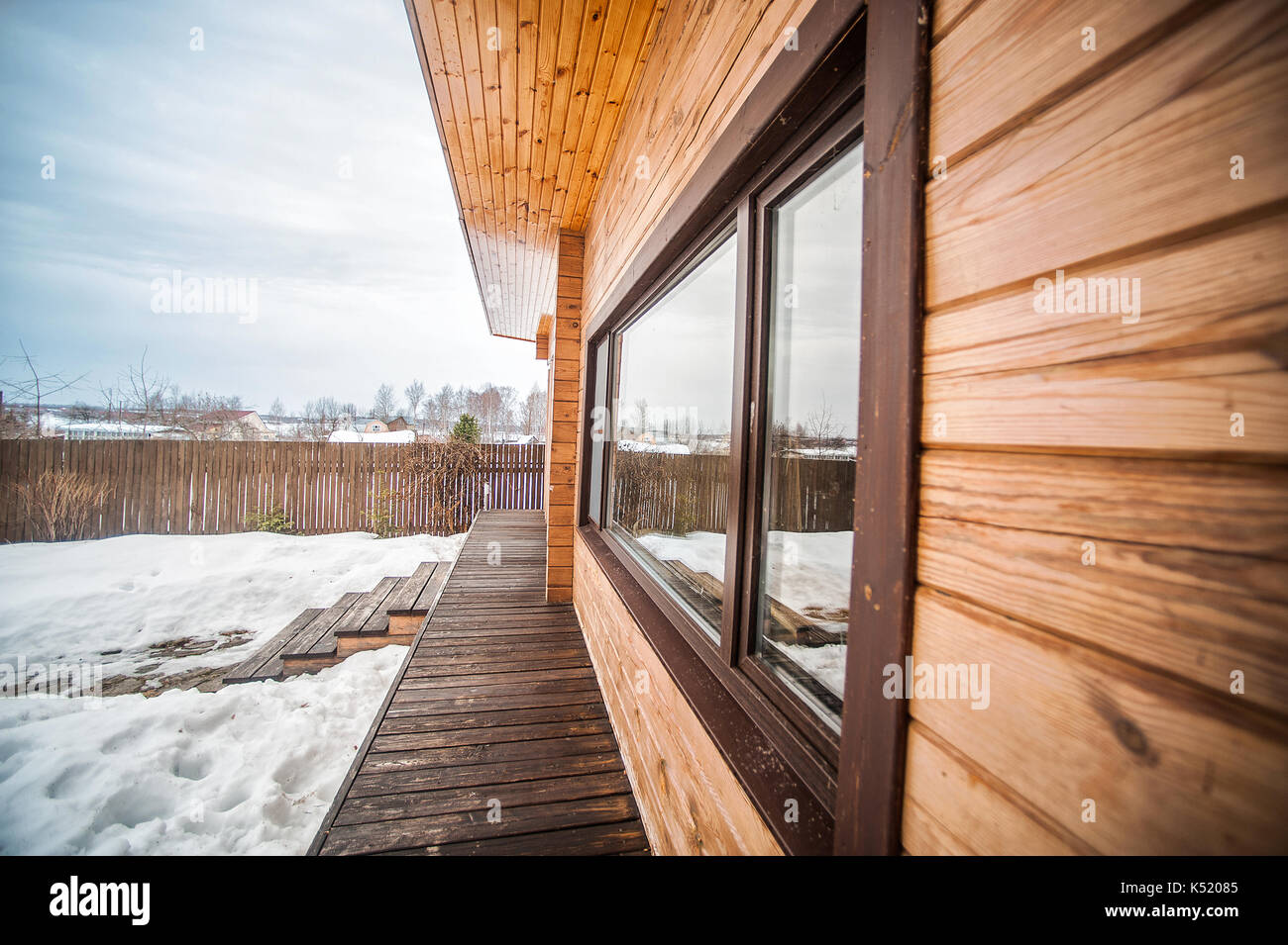 Window of a wooden house. in perspective another view Stock Photo - Alamy