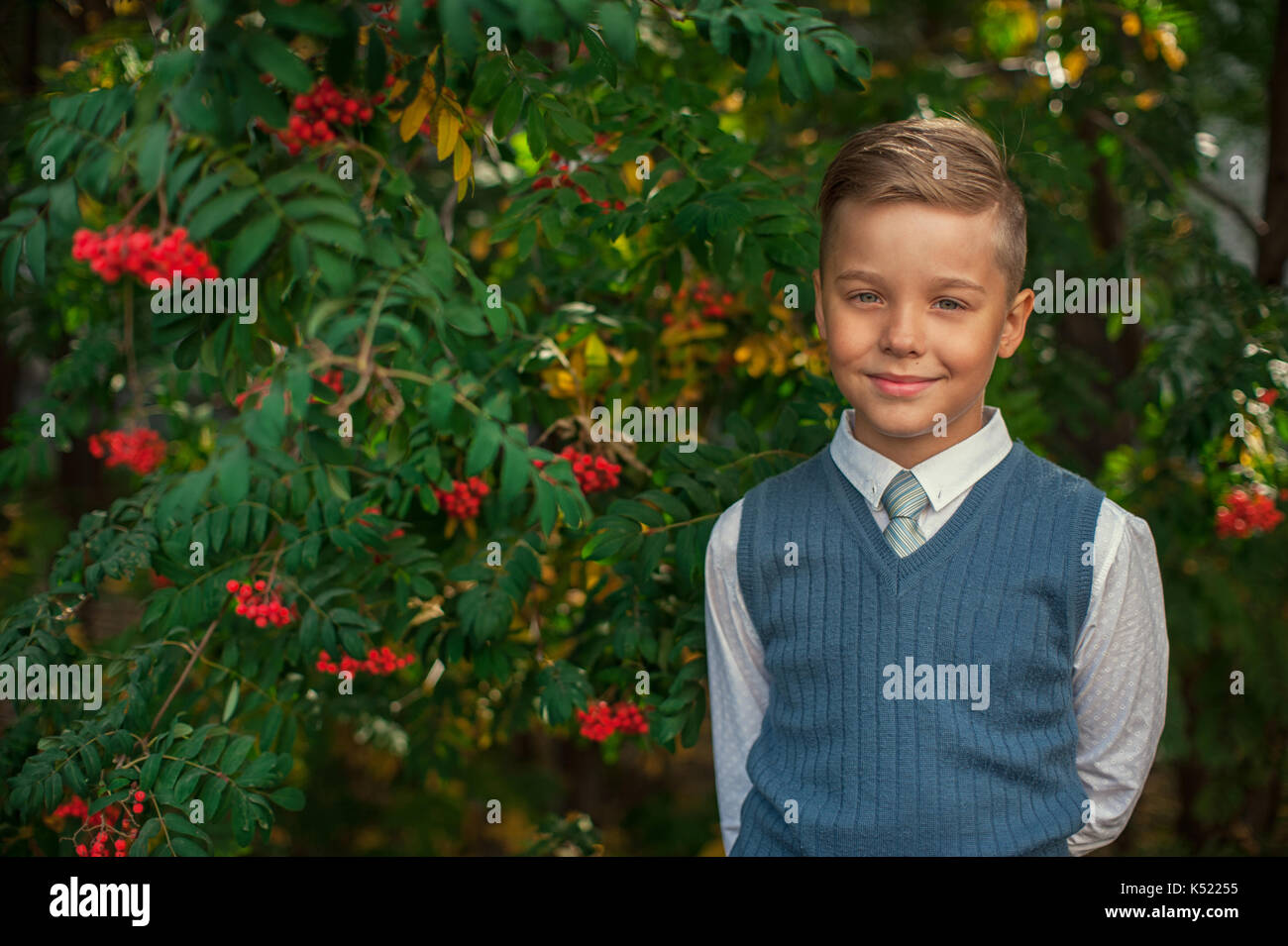 The first time in first class: happy schoolboy at school background ...