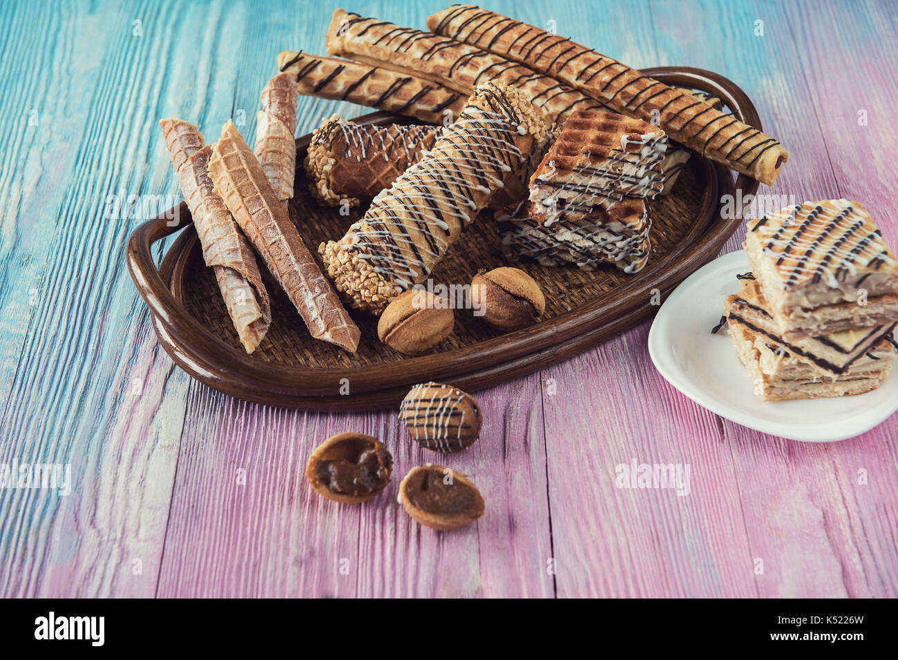 Tasty different cakes set on a color gradient background Stock Photo ...