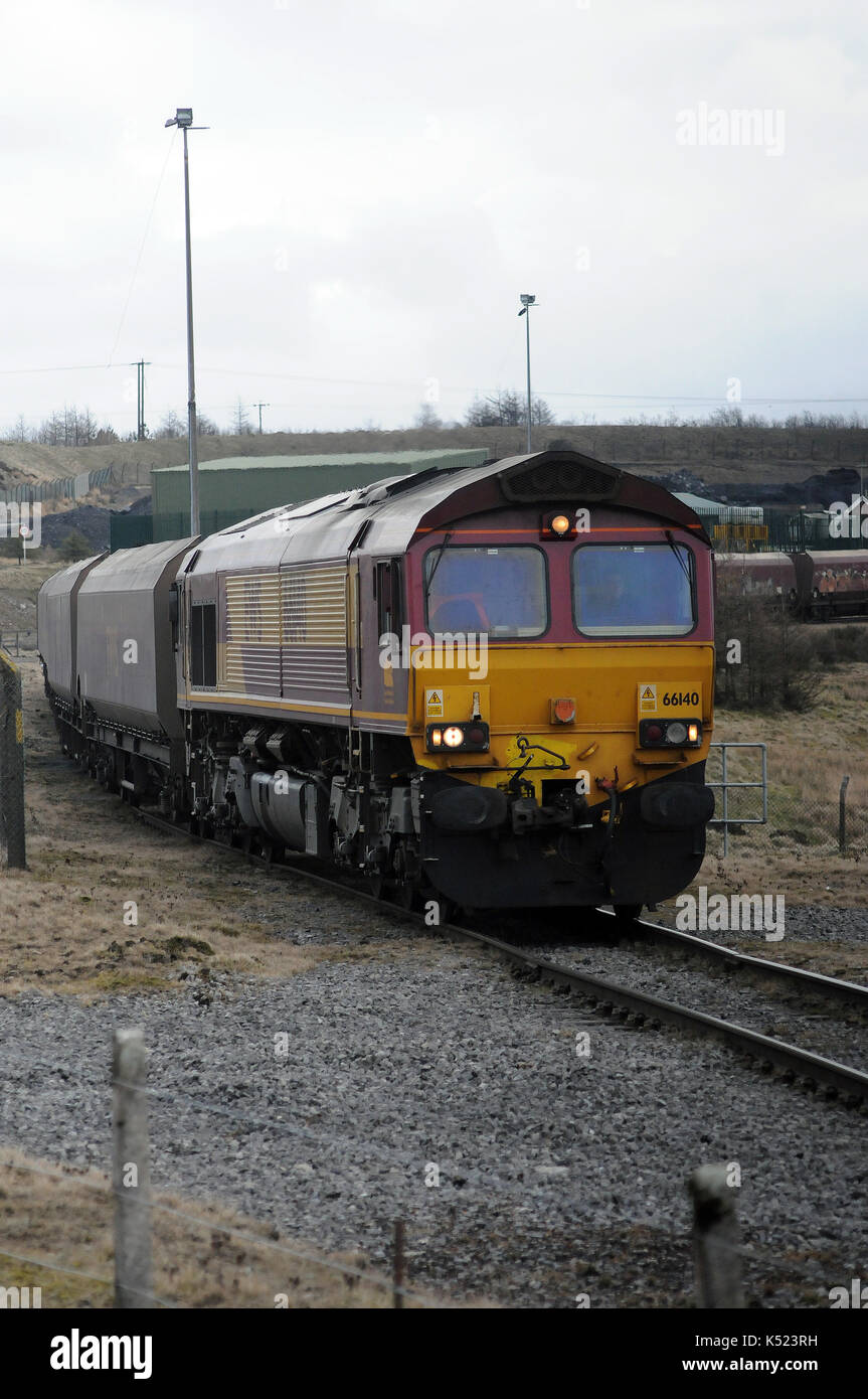 66140 leads its train away from the loading area at Cwmbargoed Disposal ...