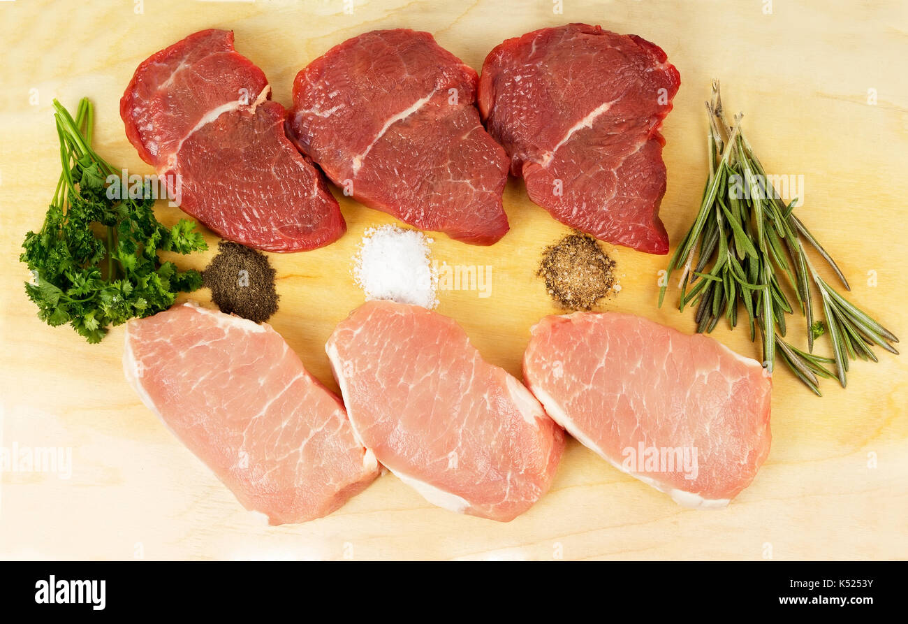 fresh beef and pork on board with spices Stock Photo - Alamy