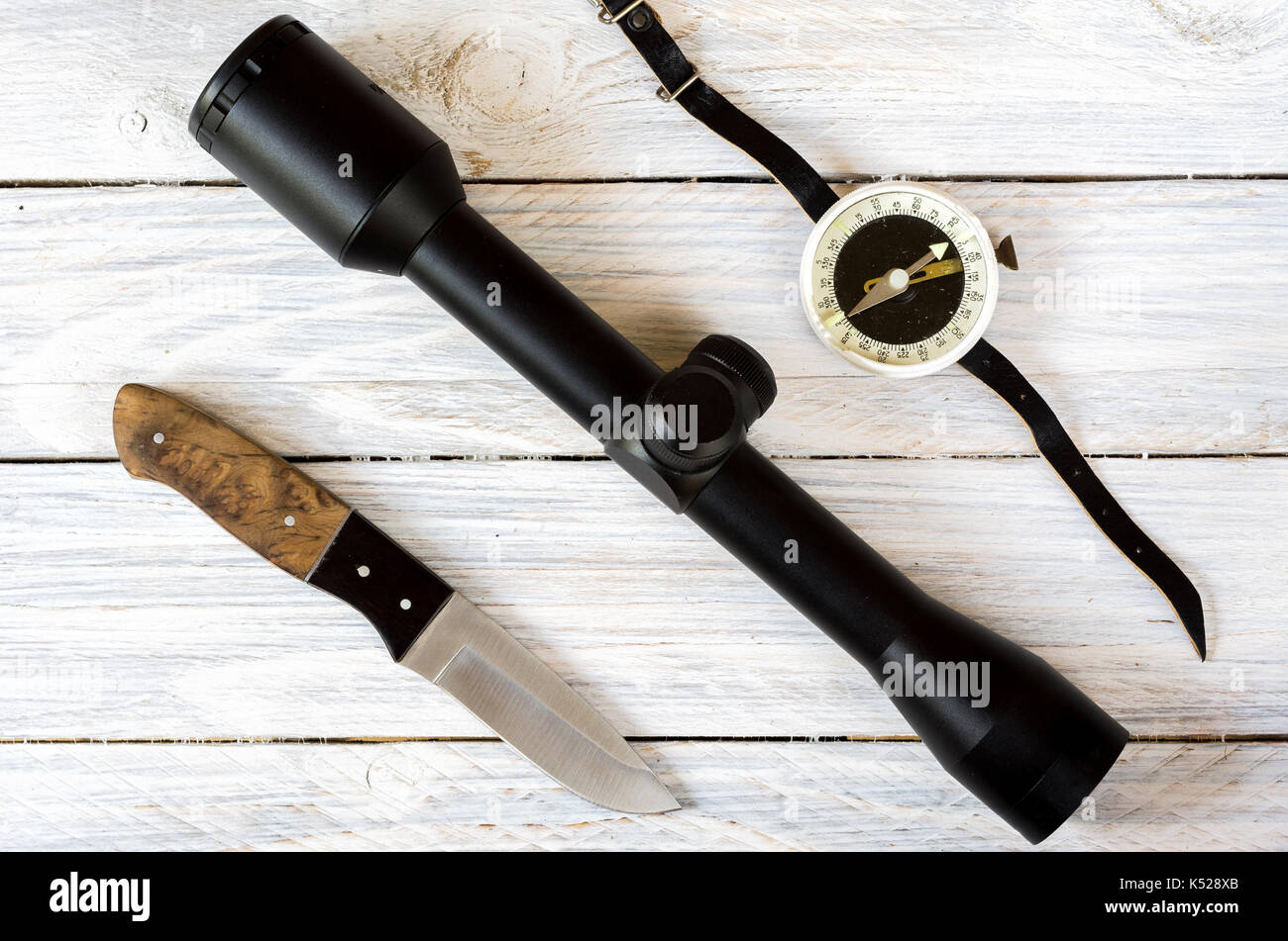 Optical sight, hunting knife and vintage compass. Hunting composition ...