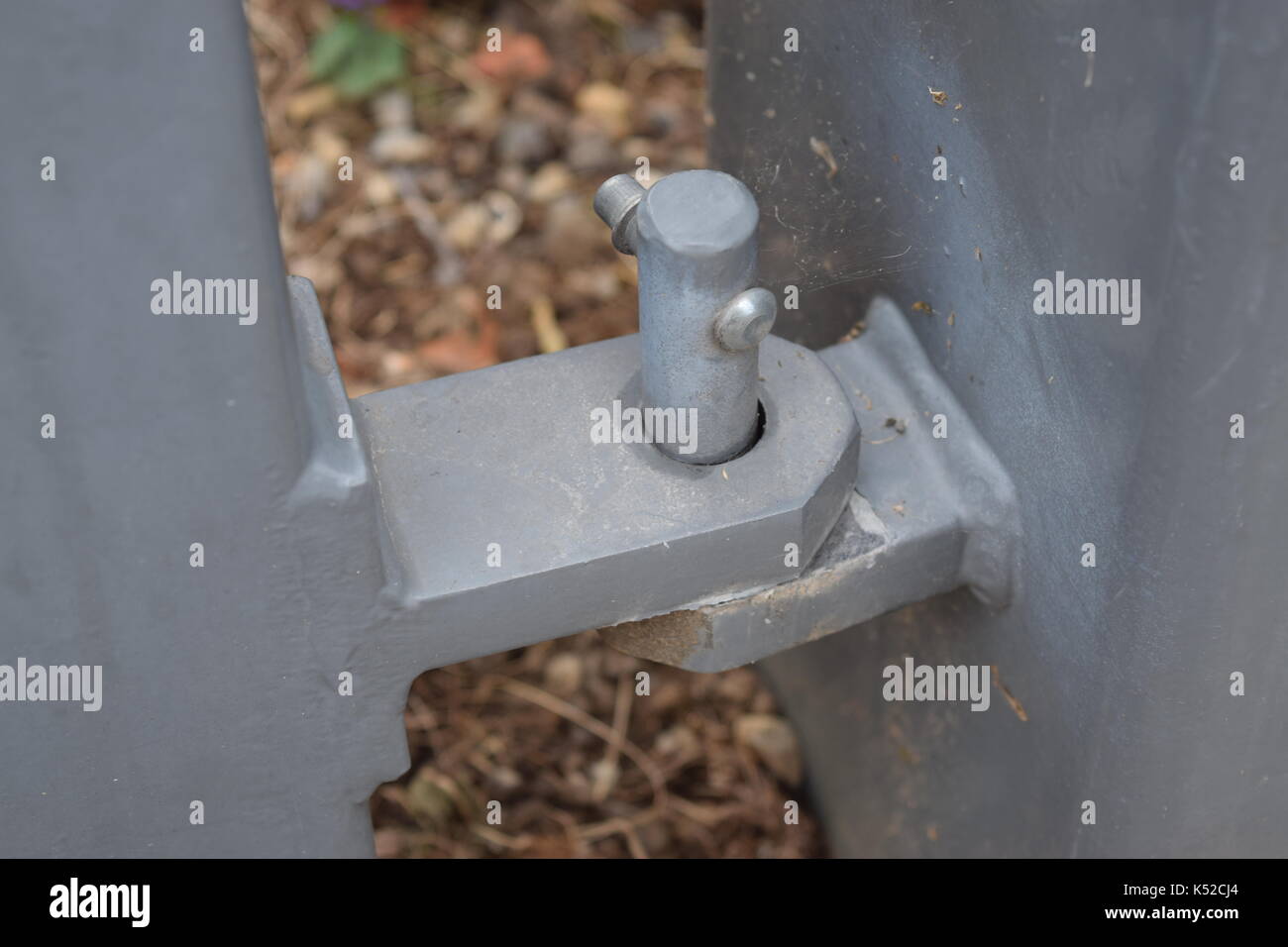 Close view of a silver gate hinge Stock Photo - Alamy