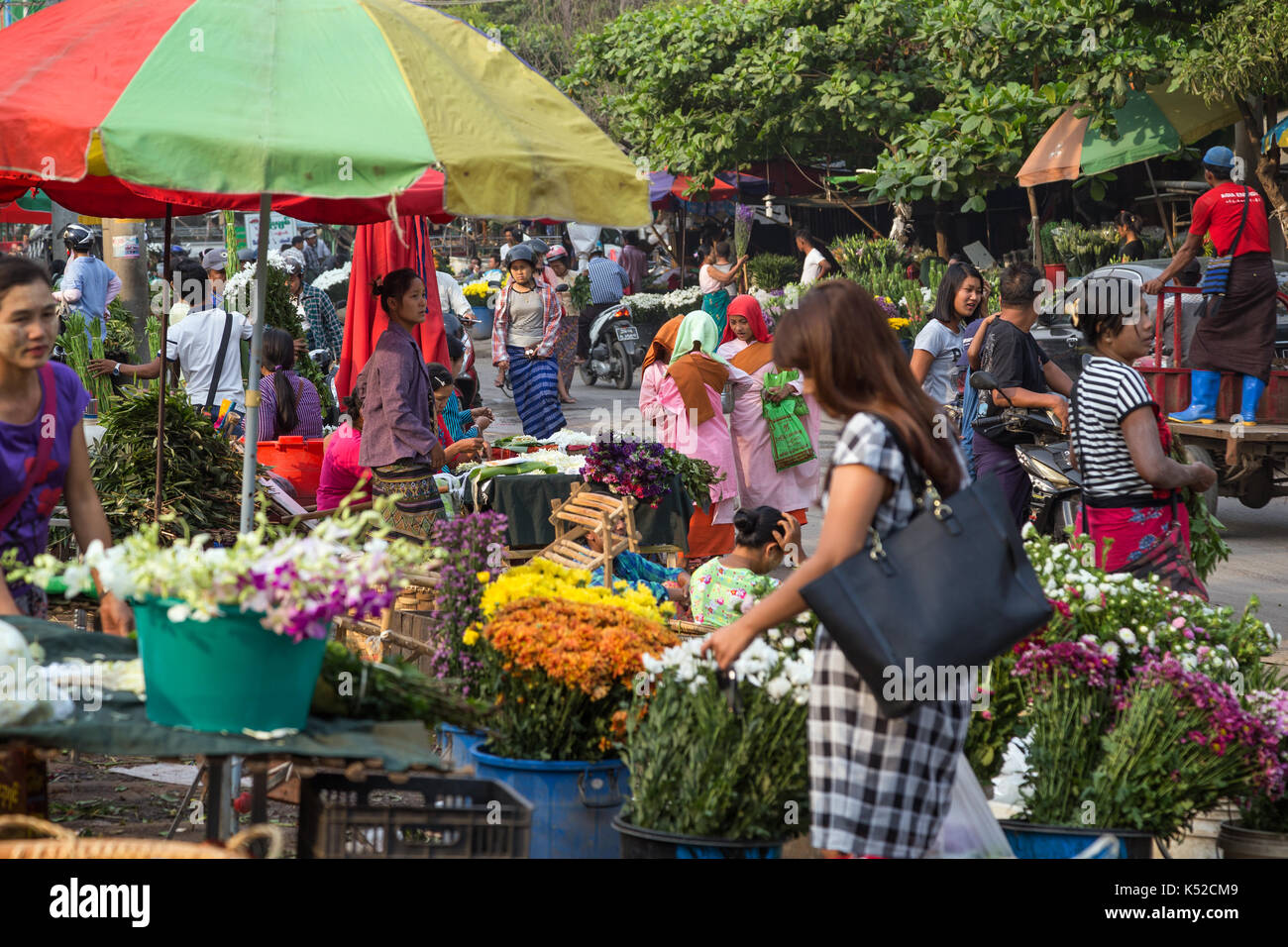 People at the busy Htin Tone Taik flower market in Mandalay, Myanmar ...