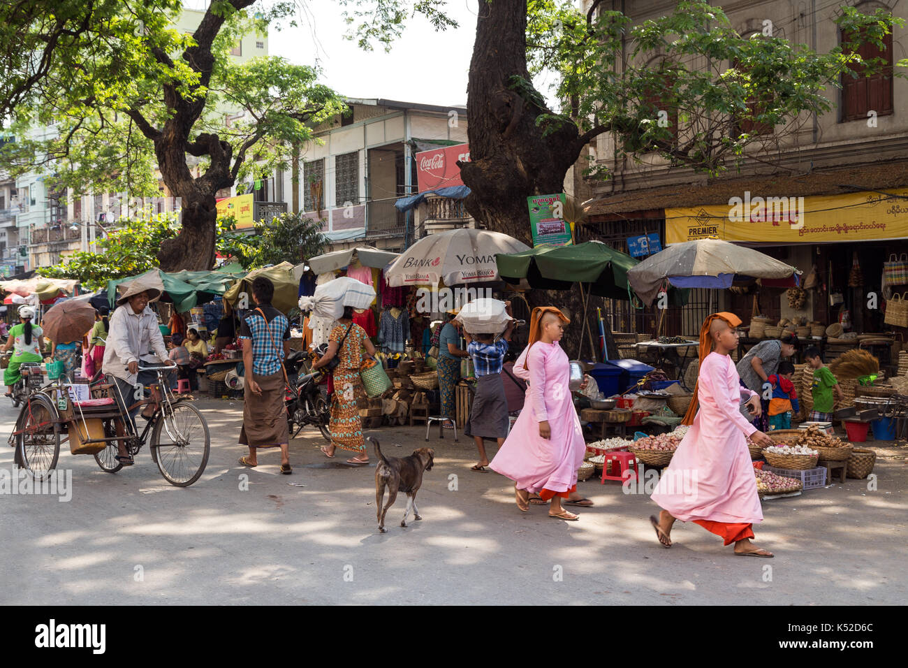 Nuns and other local people at the busy Zegyo (also known as Zay Cho ...