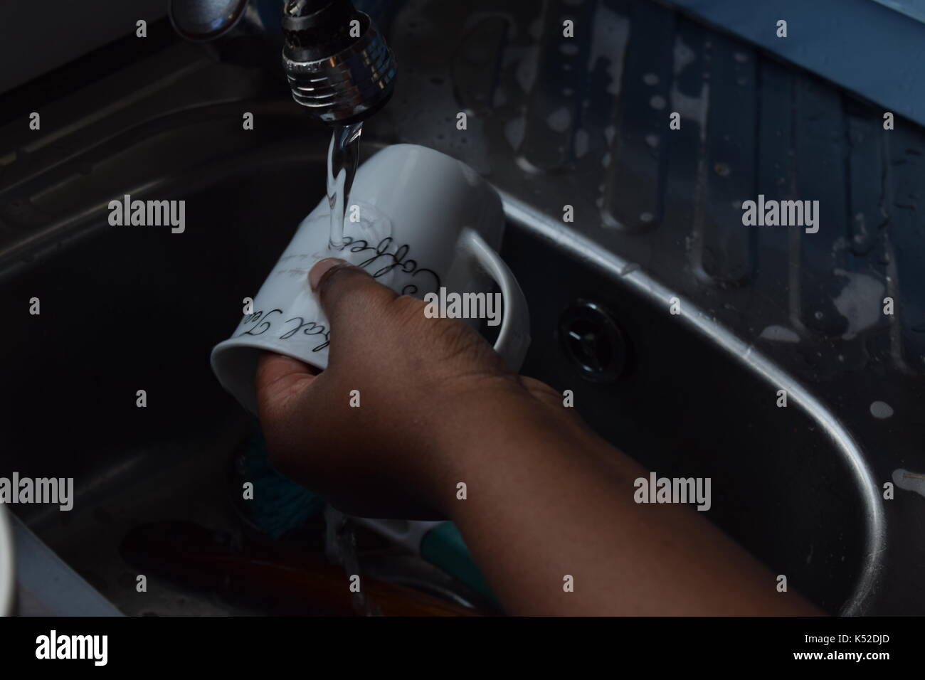 Female hands washing a mug Stock Photo - Alamy