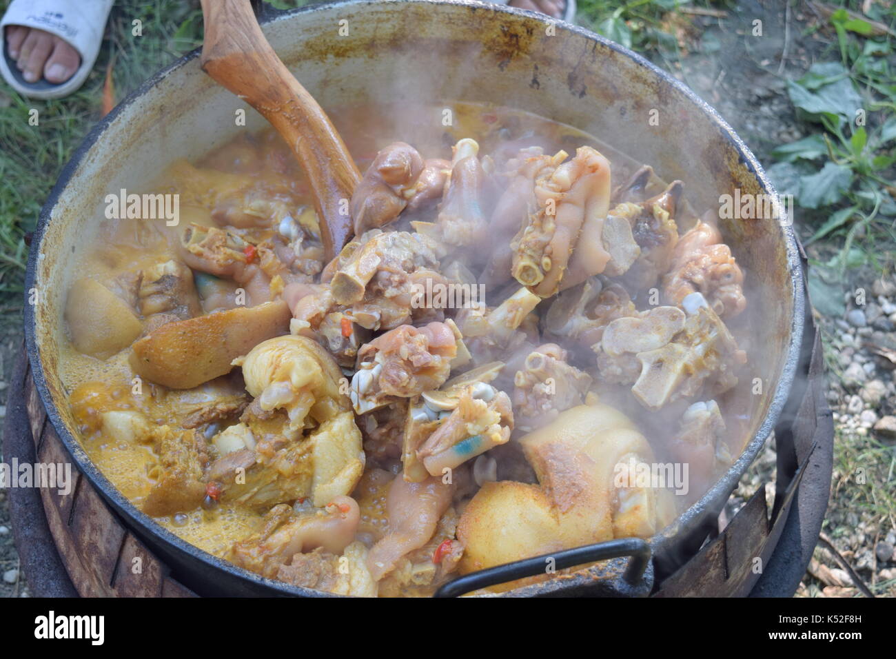 Close up of steaming hot stew cooking with a wooden spoon Stock Photo ...