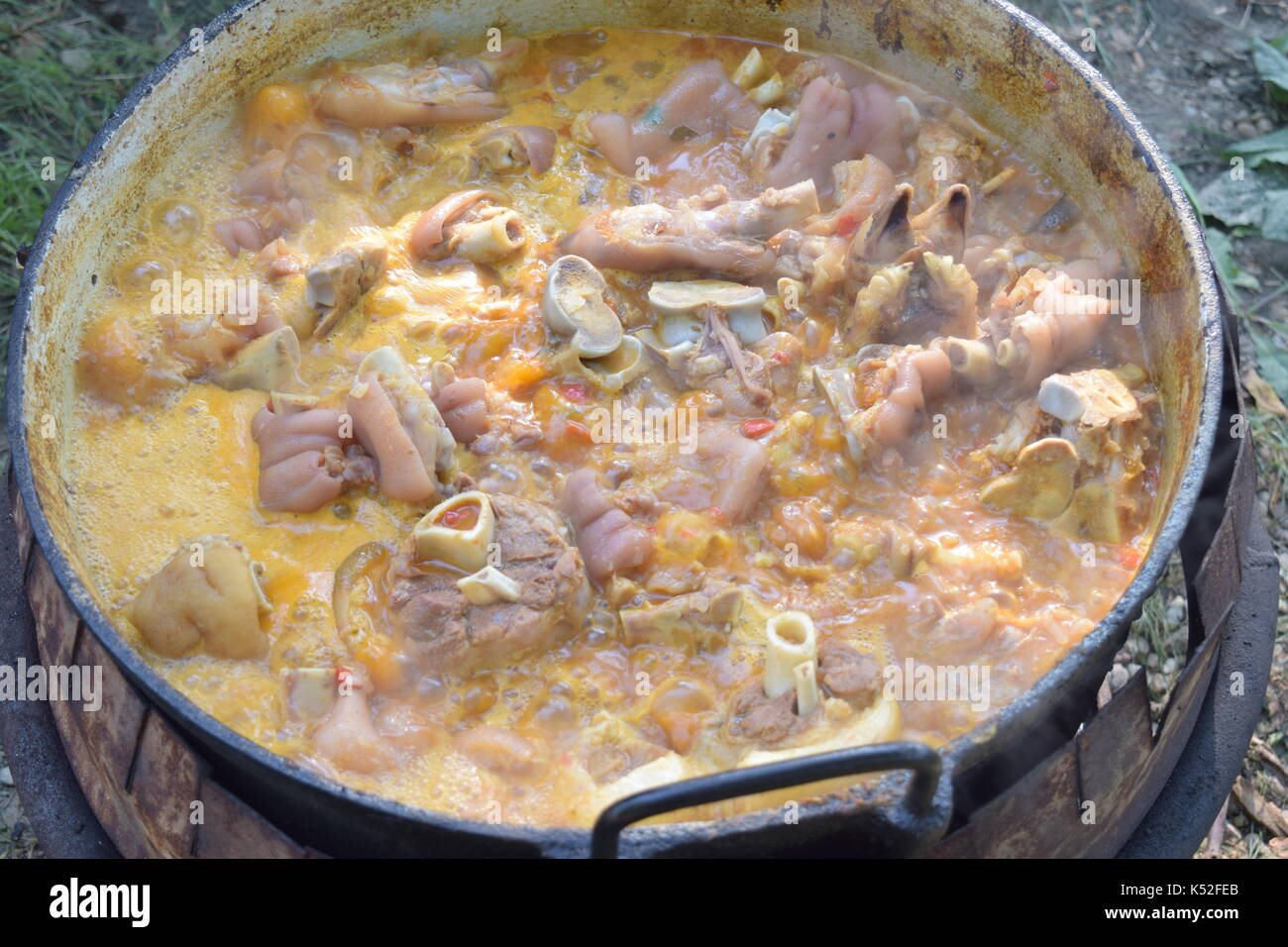 Meat stew cooking in a large metal pot Stock Photo - Alamy