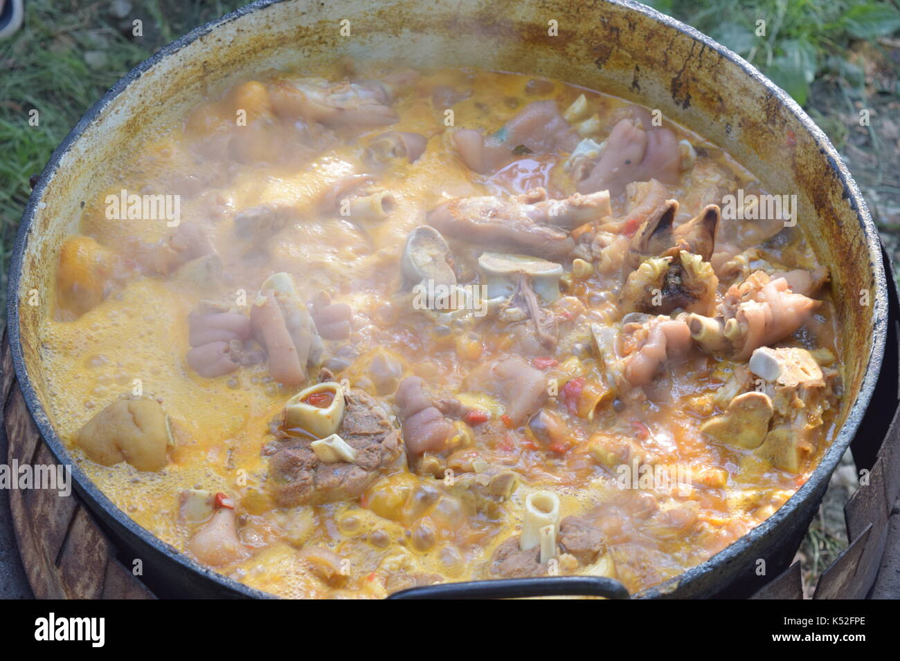 Meat stew cooking in a large metal pot Stock Photo - Alamy